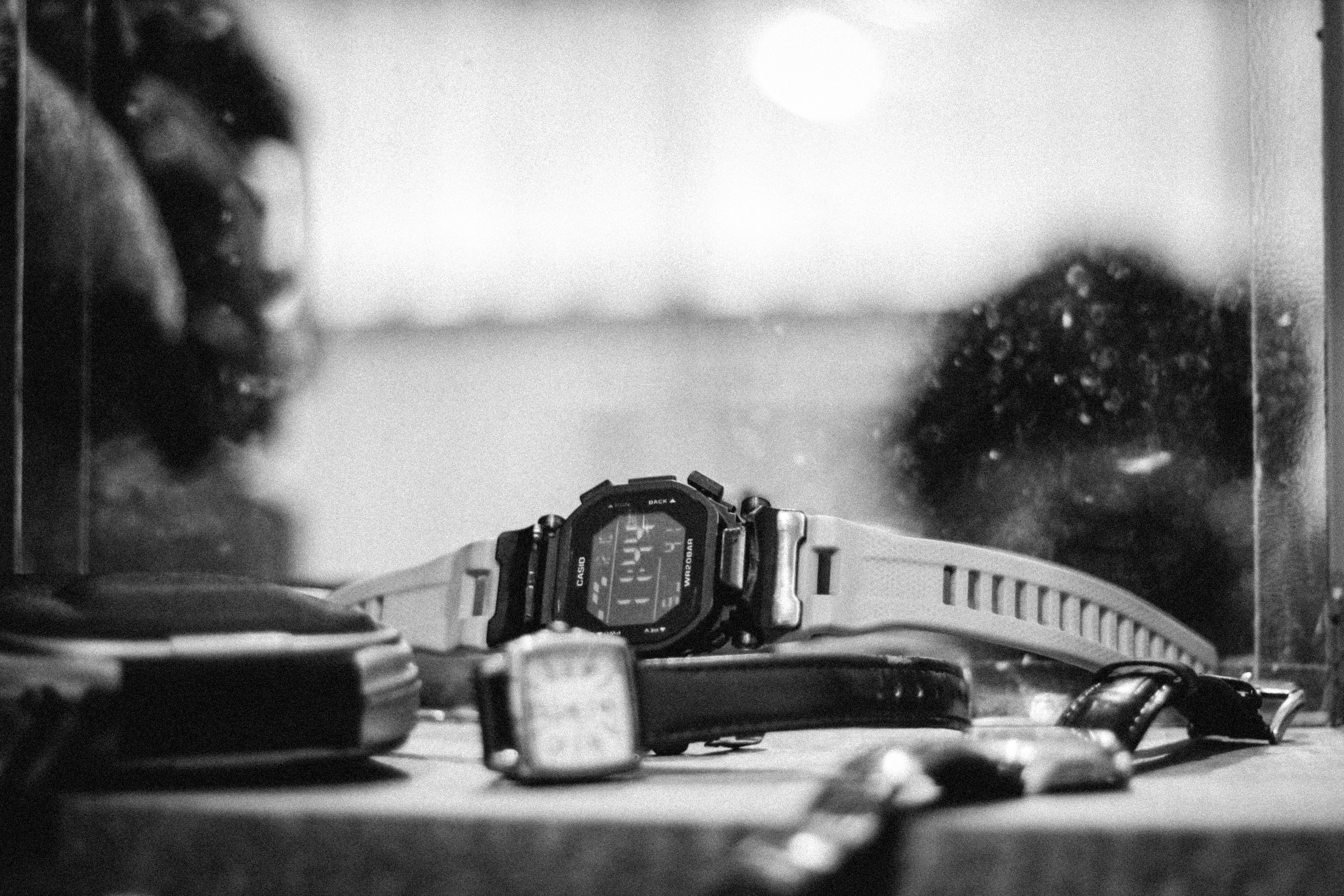A black and white photo of a watch on a table photo – Free Grain Image ...