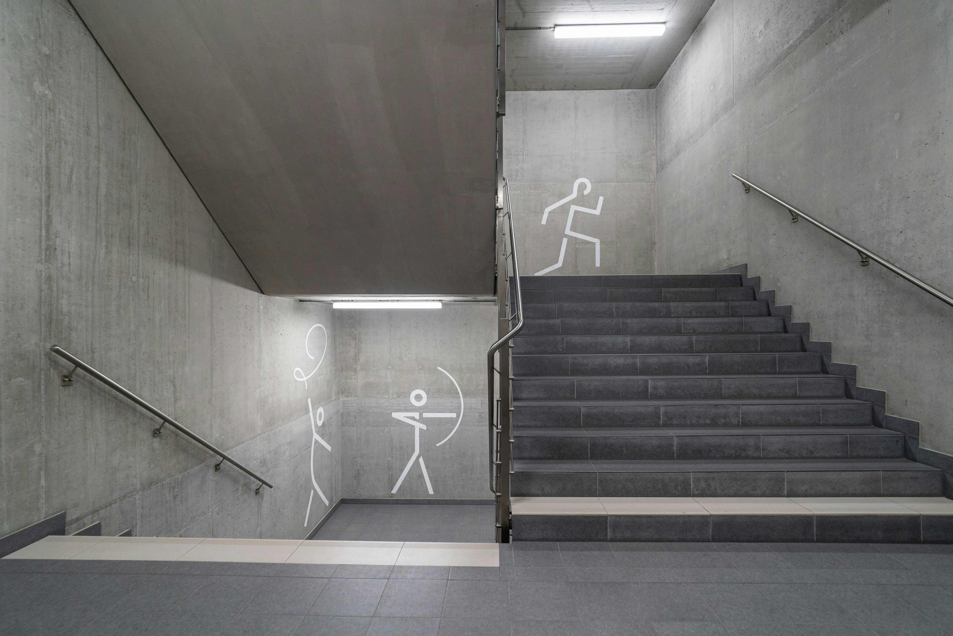 Stairwell Chalk Figures: A Quiet Parade Through Concrete