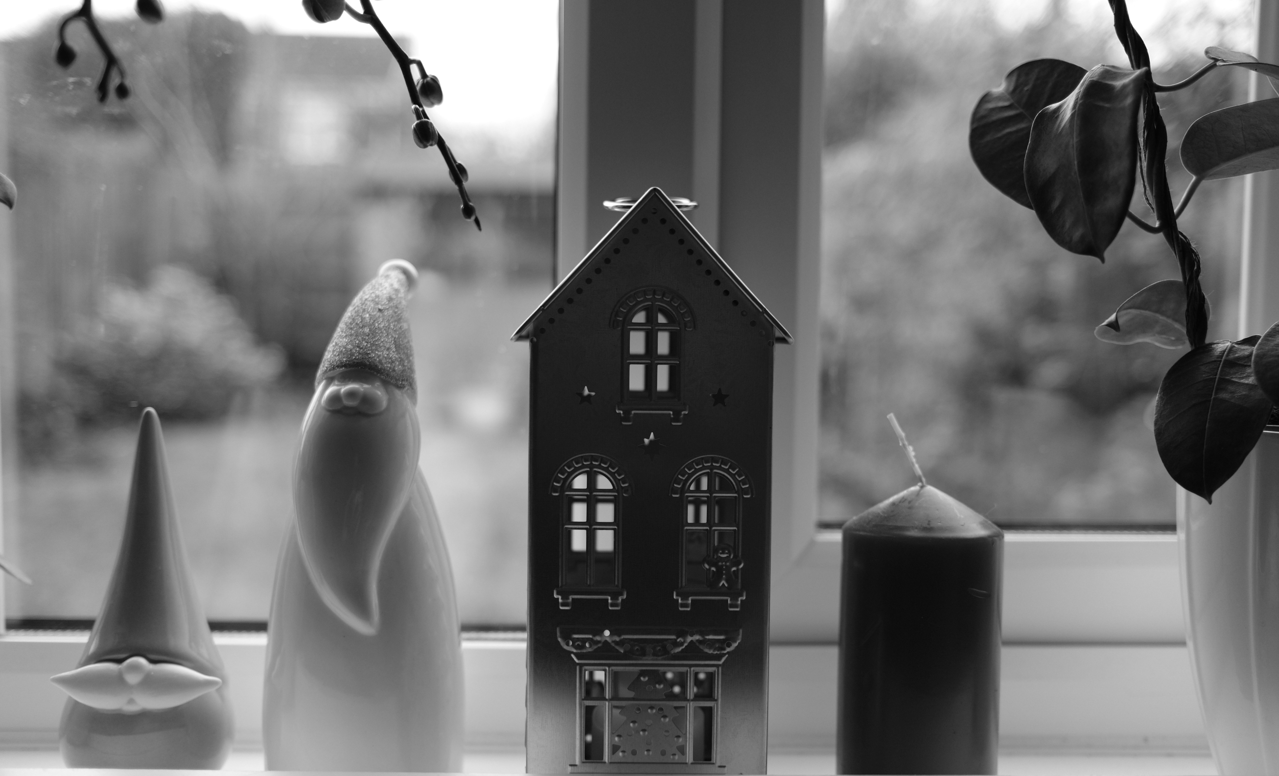 Monochrome Window Still Life: A Tiny House Guarded by Gnomes and Candle