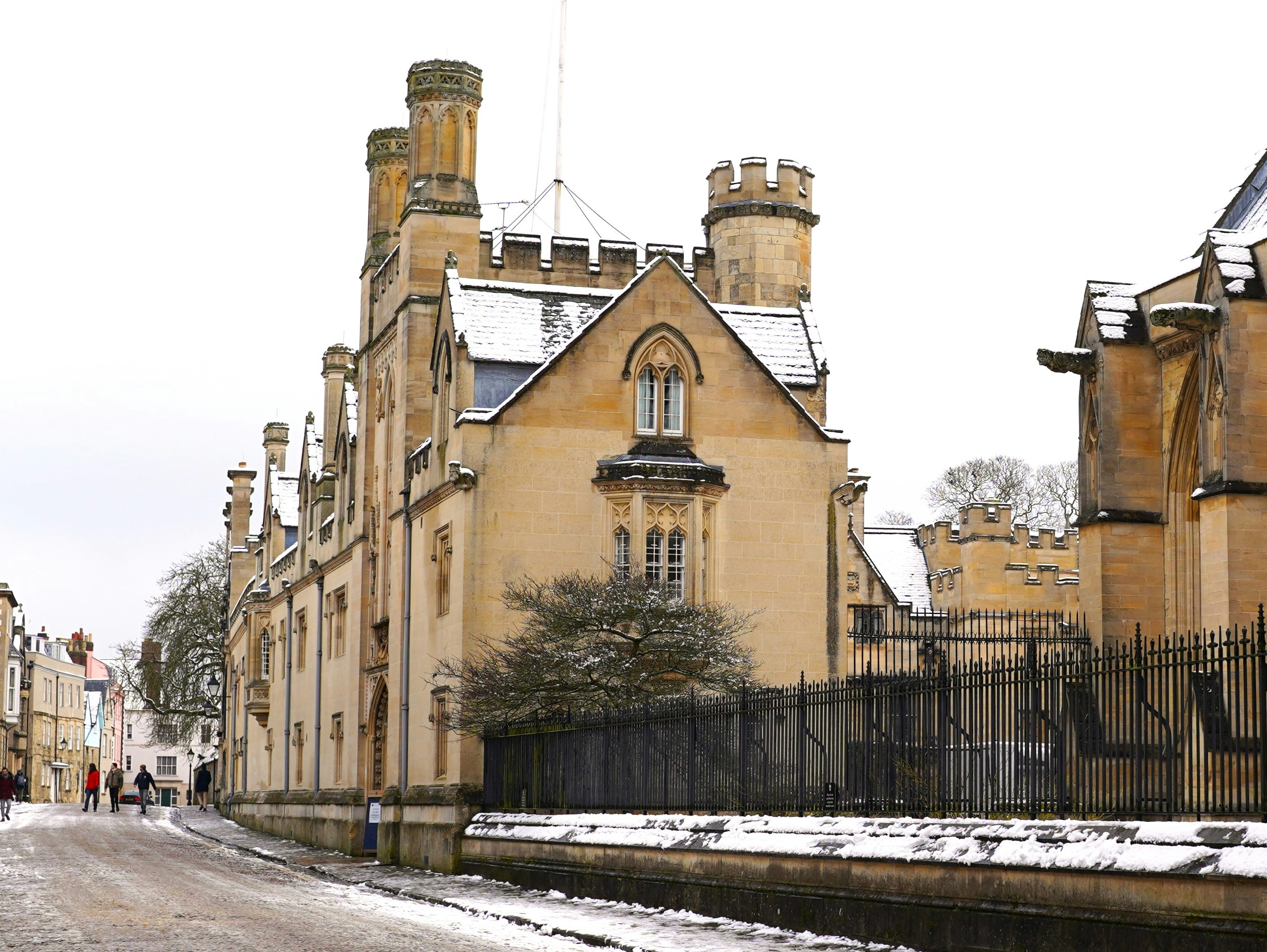 Winter Silhouette: Yellow Stone Towers on a Snow-Swept Street