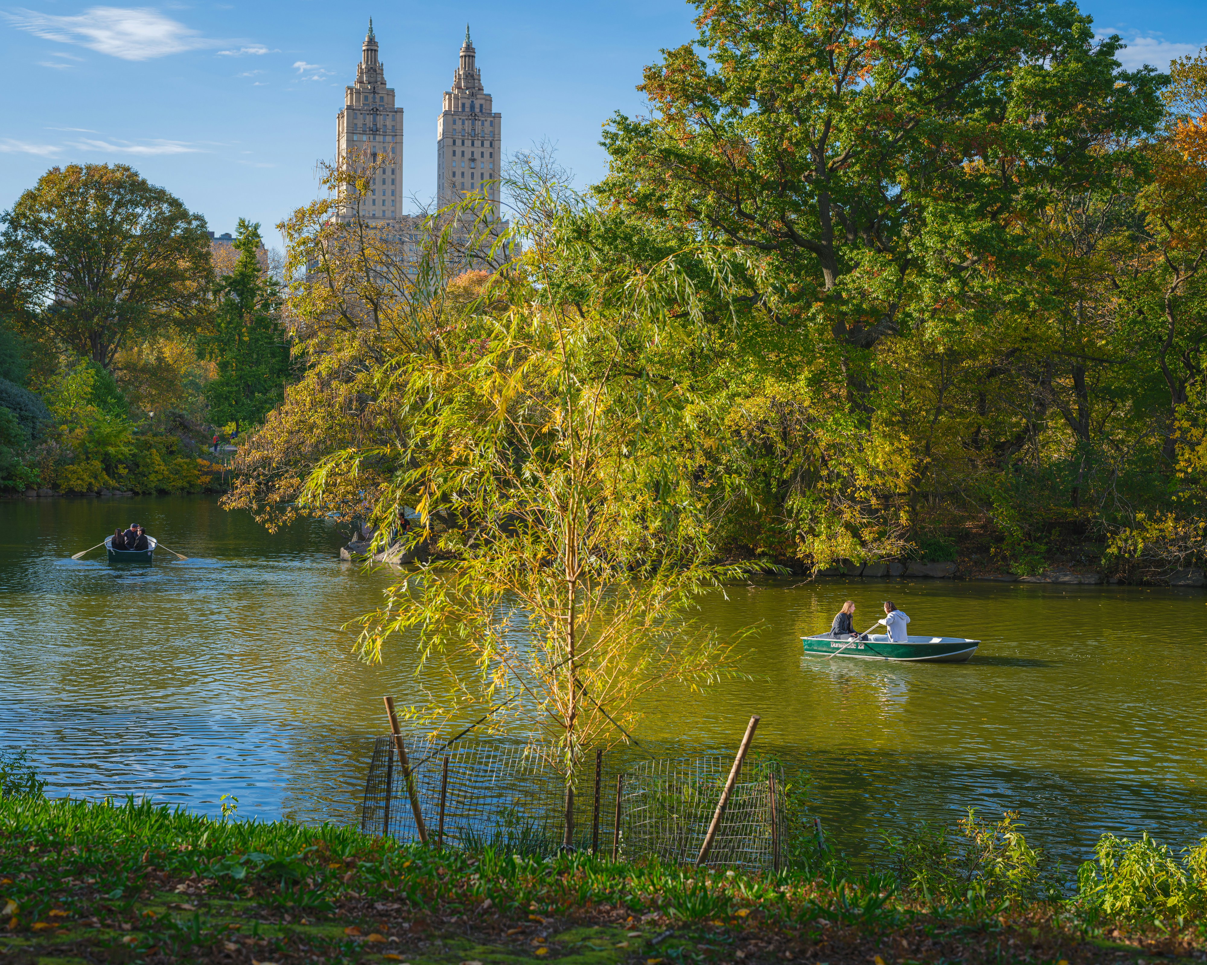 Two people in a small boat on a river photo – Free Central park Image ...