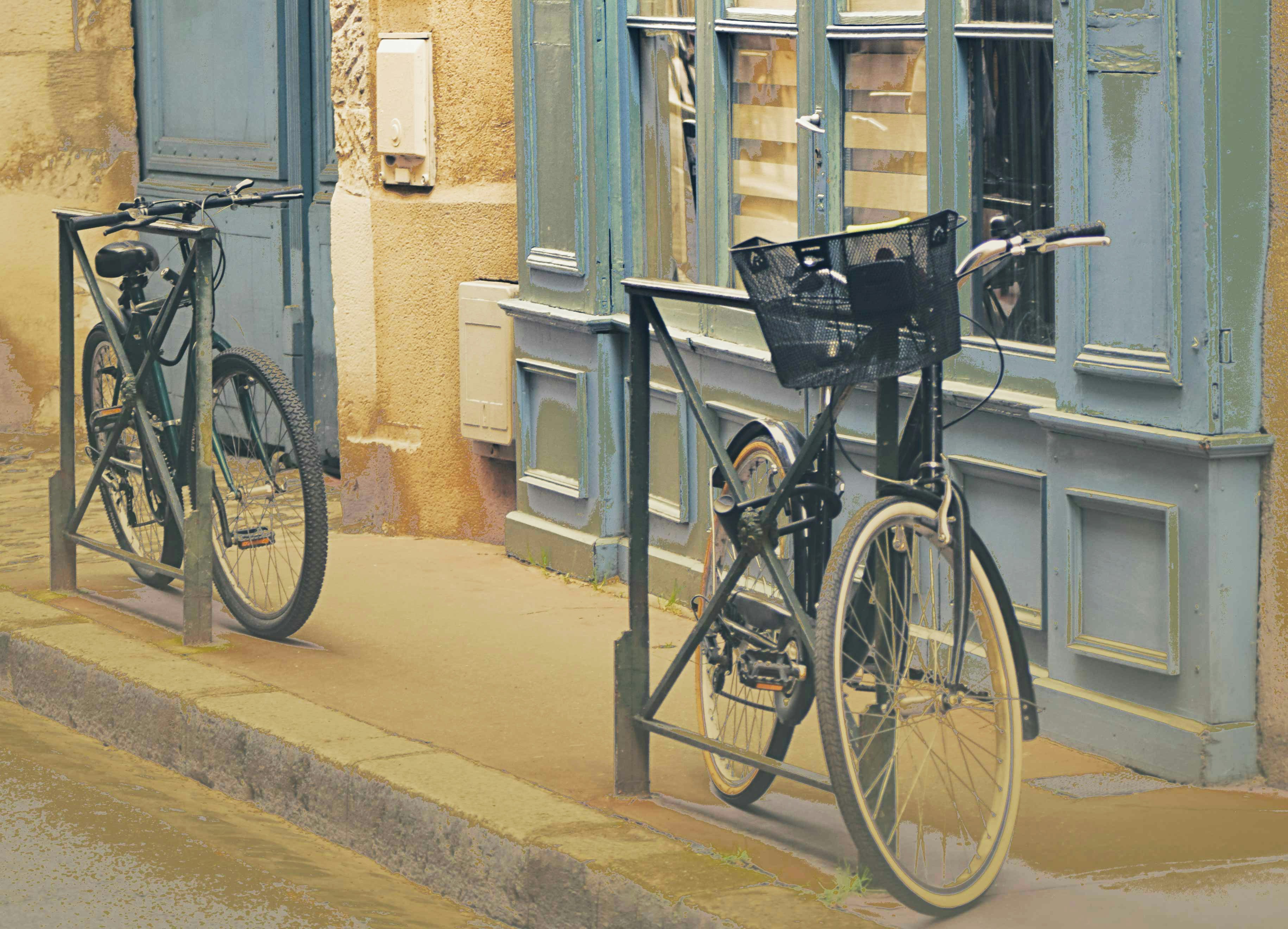 Two bikes parked next to each other near a building photo – Free France ...