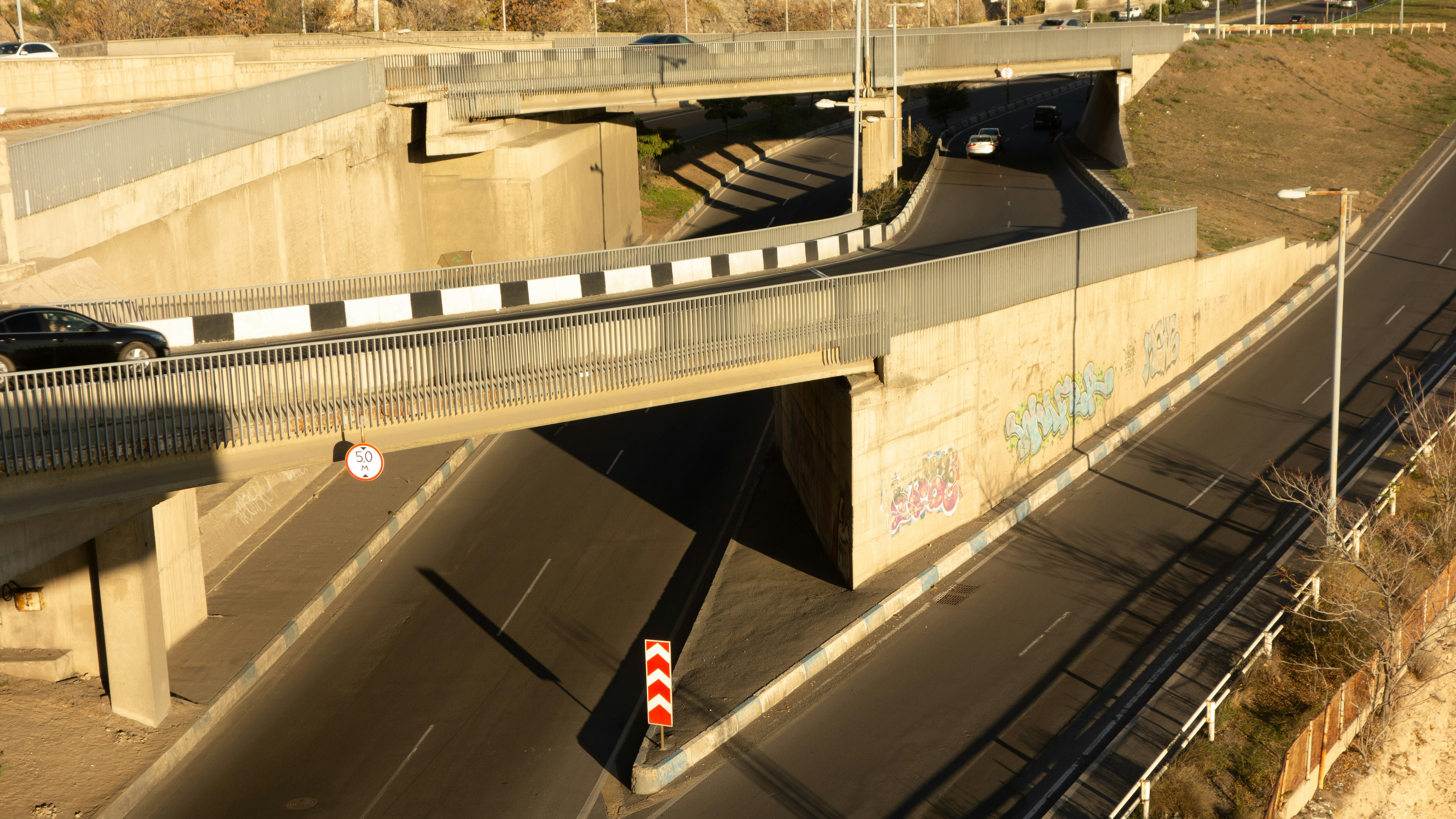 A view of a highway with a bridge over it photo – Free Bridge Image on ...