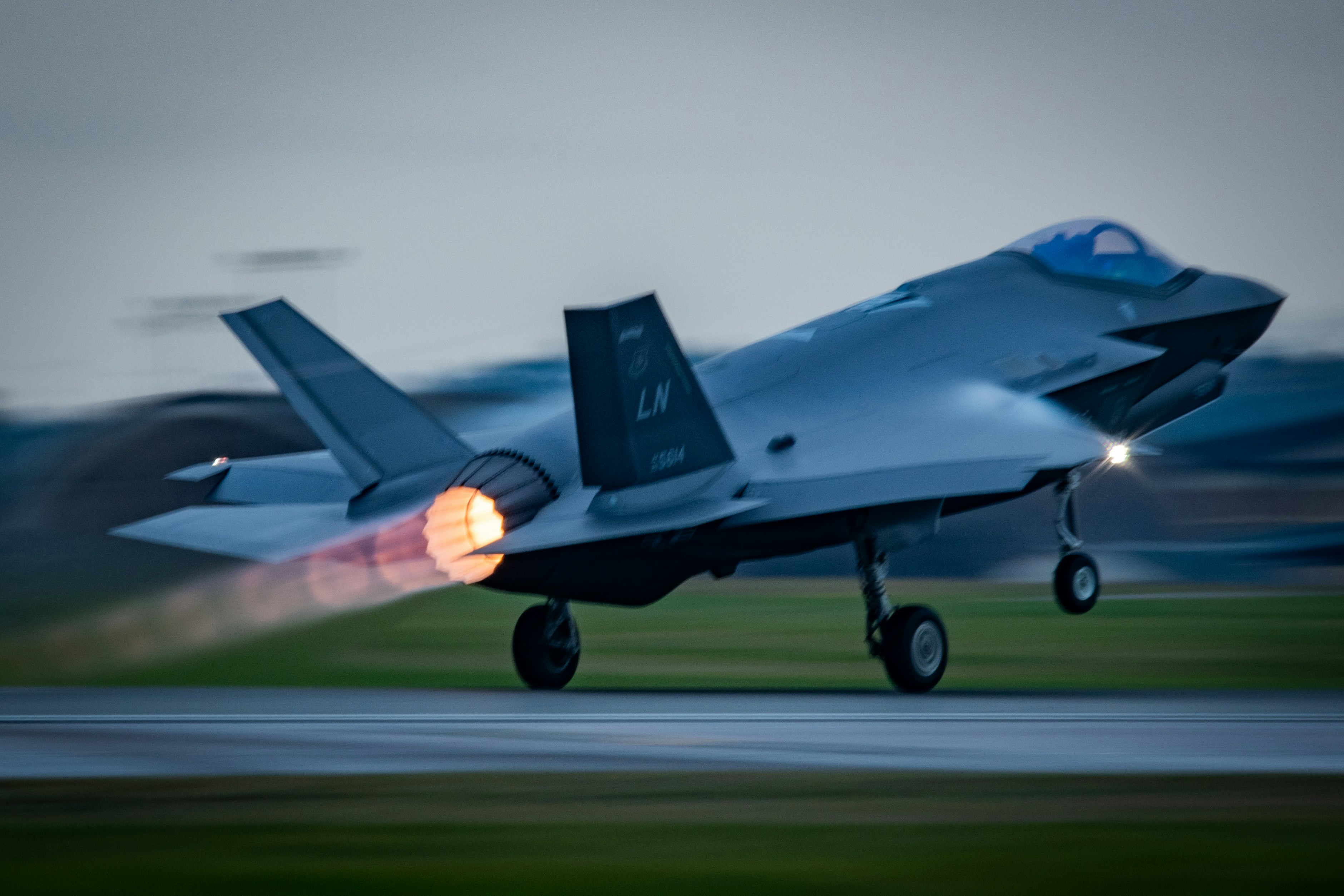 A fighter jet taking off from an airport runway photo – Free Takeoff ...