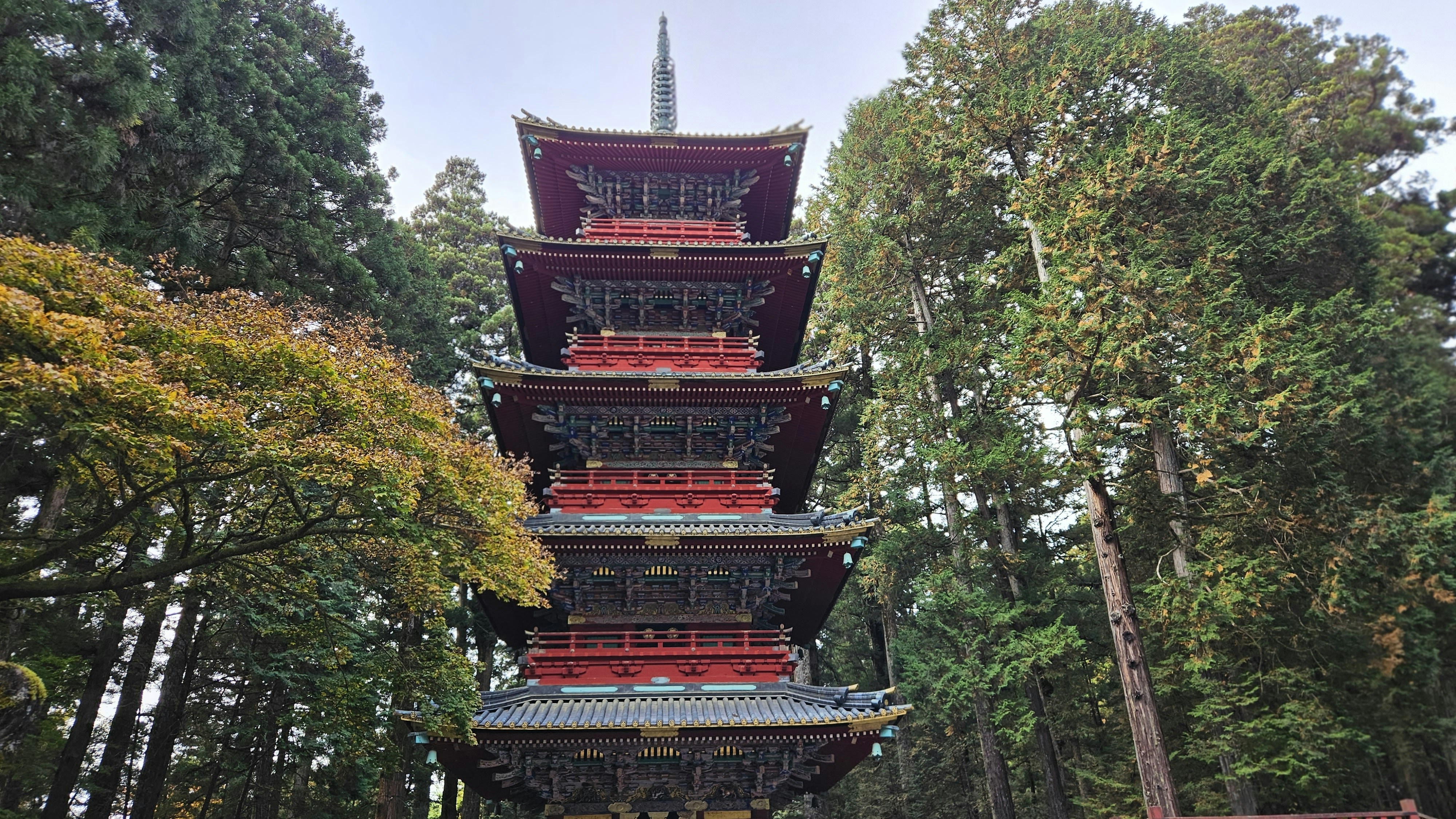 A tall pagoda in the middle of a forest photo – Free Shrine Image on ...