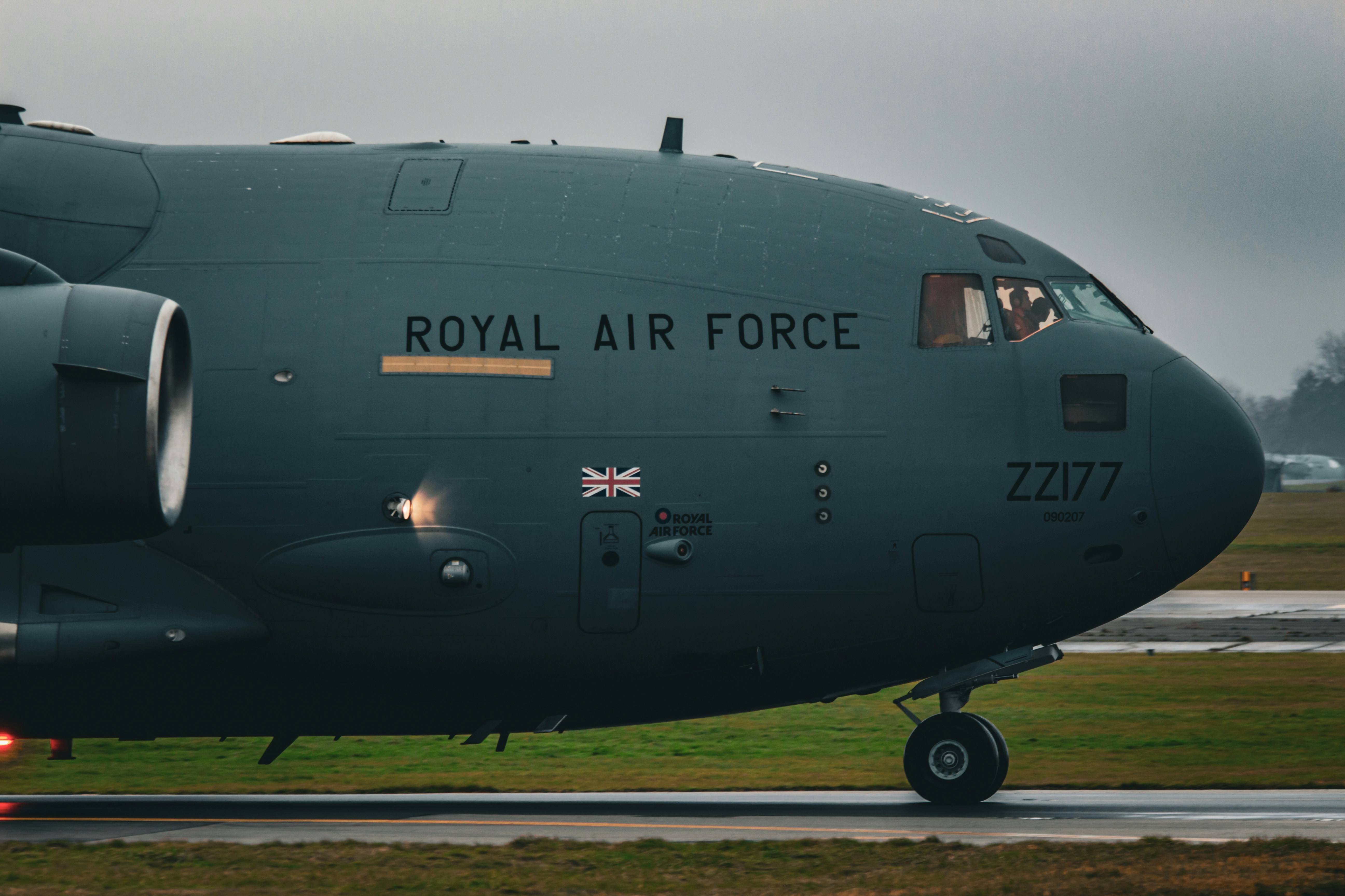 A royal air force jet sitting on top of an airport runway photo – Free ...