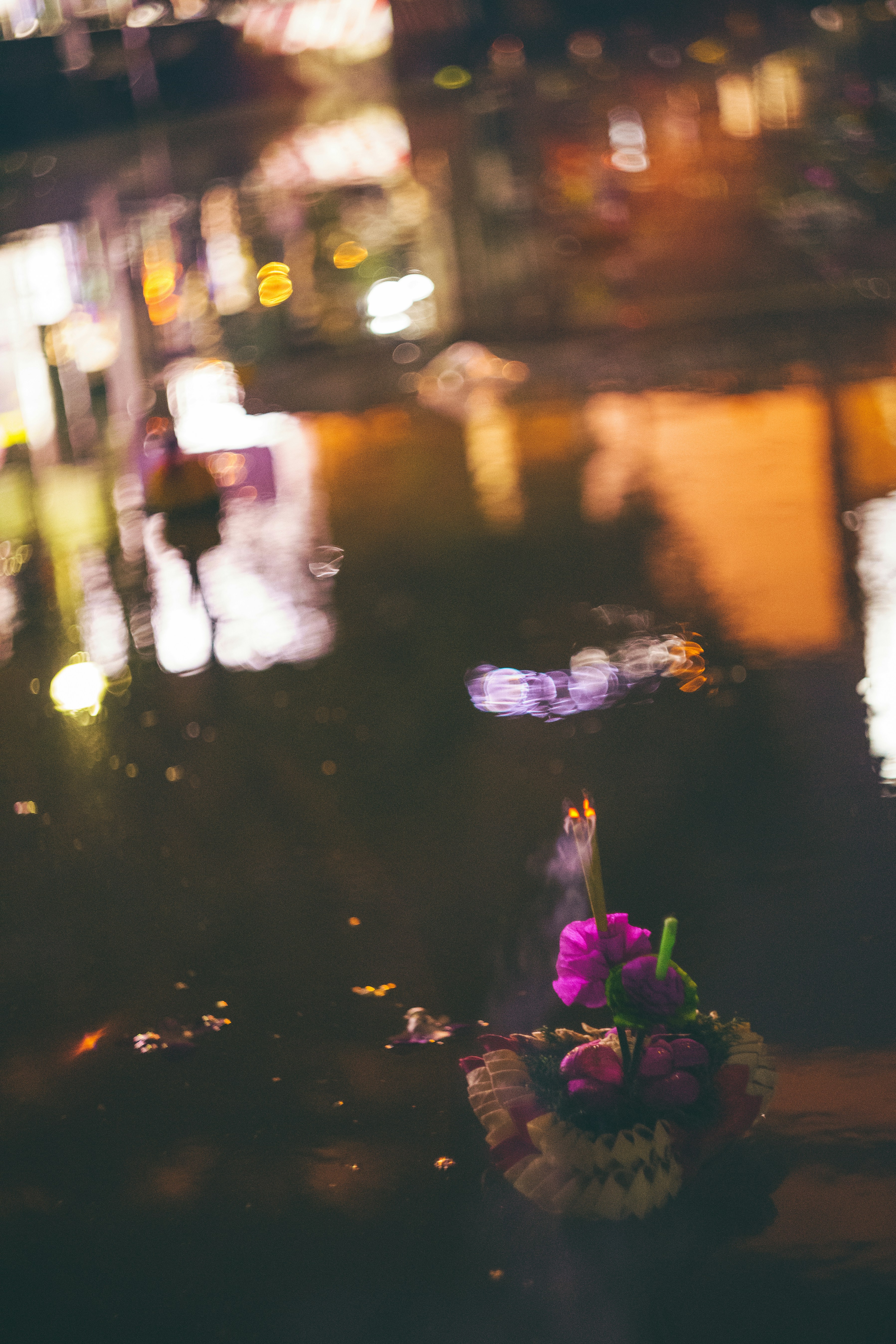 Petal Lantern on Night-Water: A Floating Flame Amid Neon Ripples