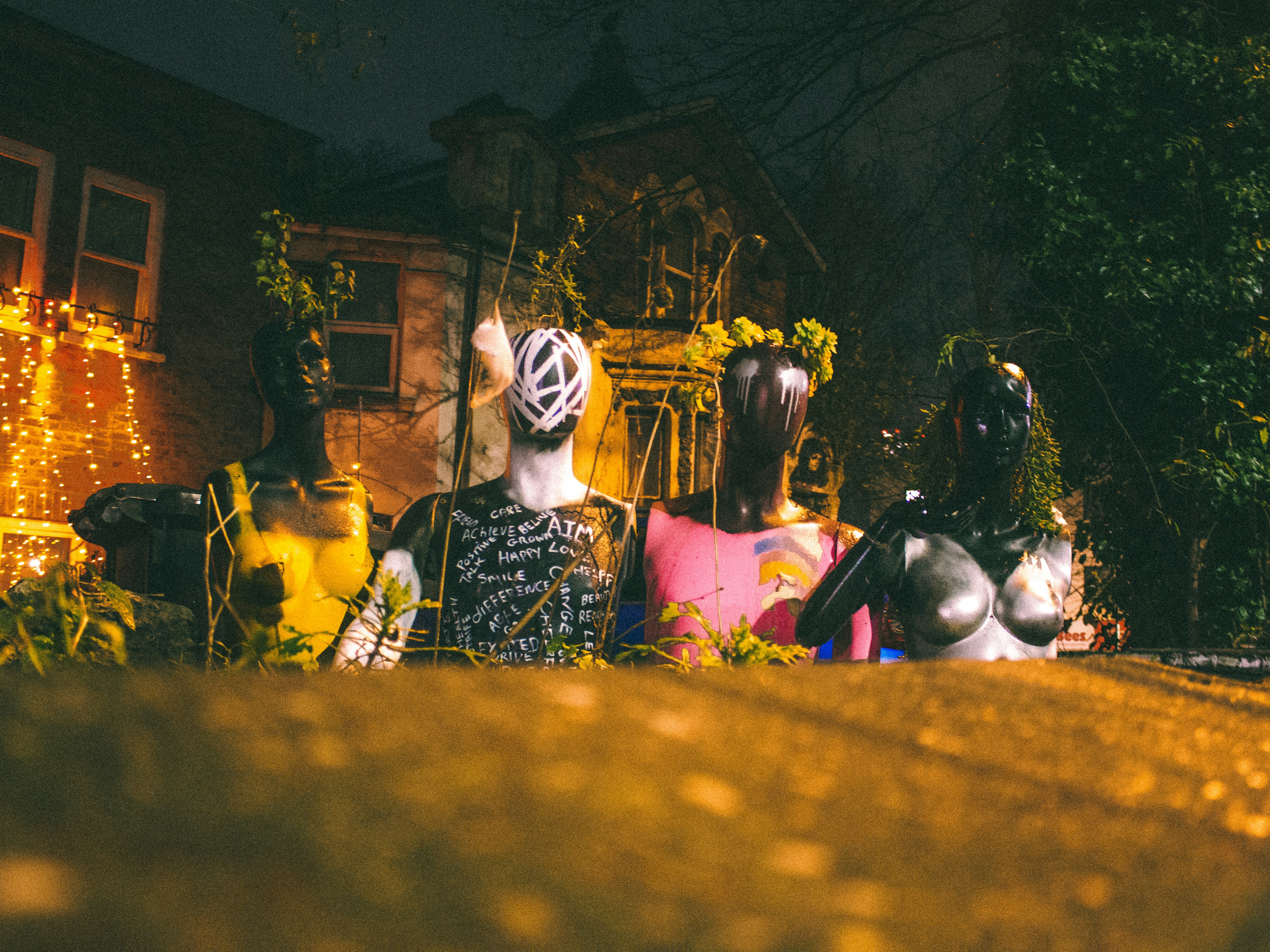 Nocturne of Anonymous Figures: Four Costumed Silhouettes Guard a Rooftop Vigil