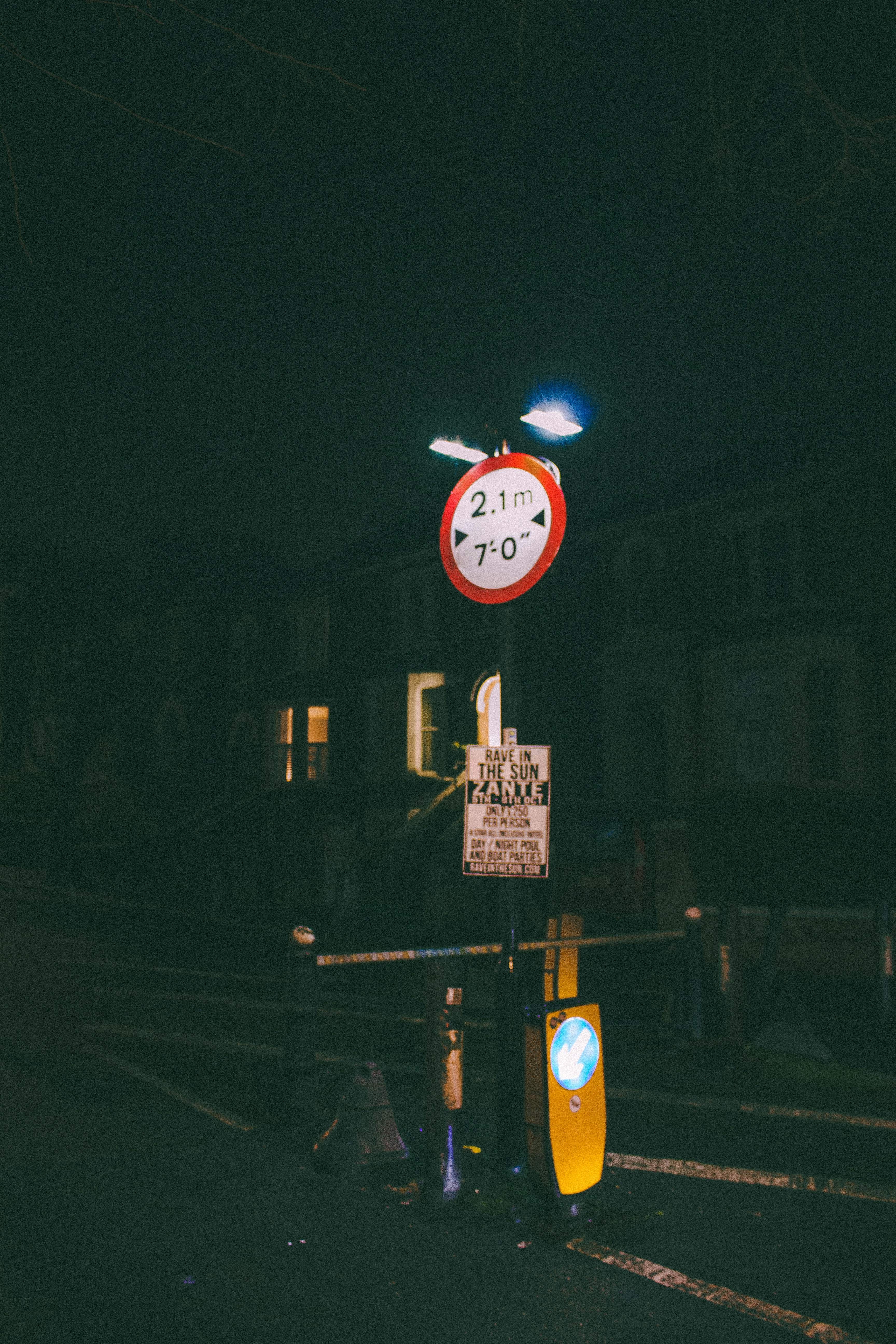 Night Street Sign: A Quiet Pause Under Street Lamps