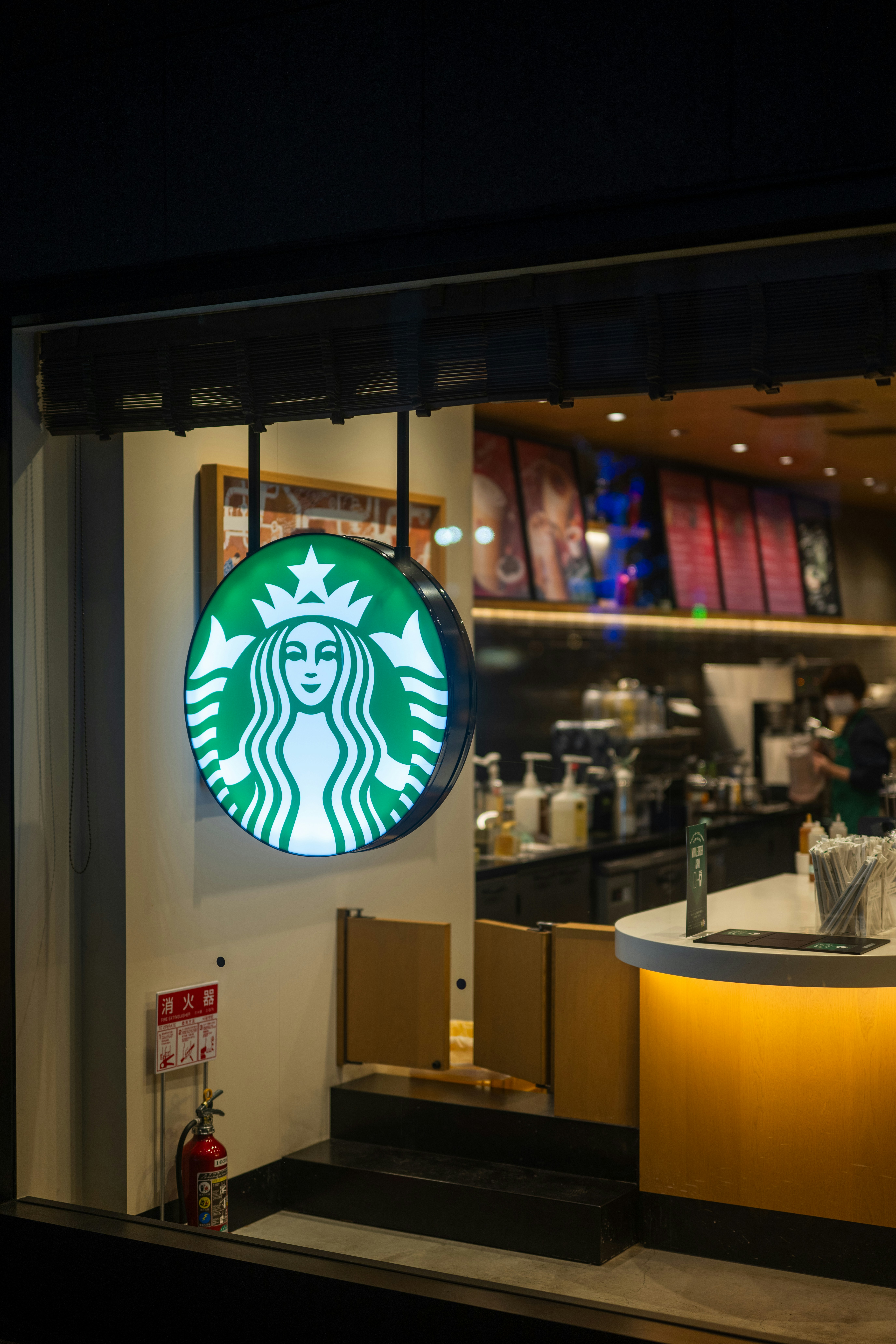 A starbucks sign in front of a restaurant photo – Free Image on Unsplash