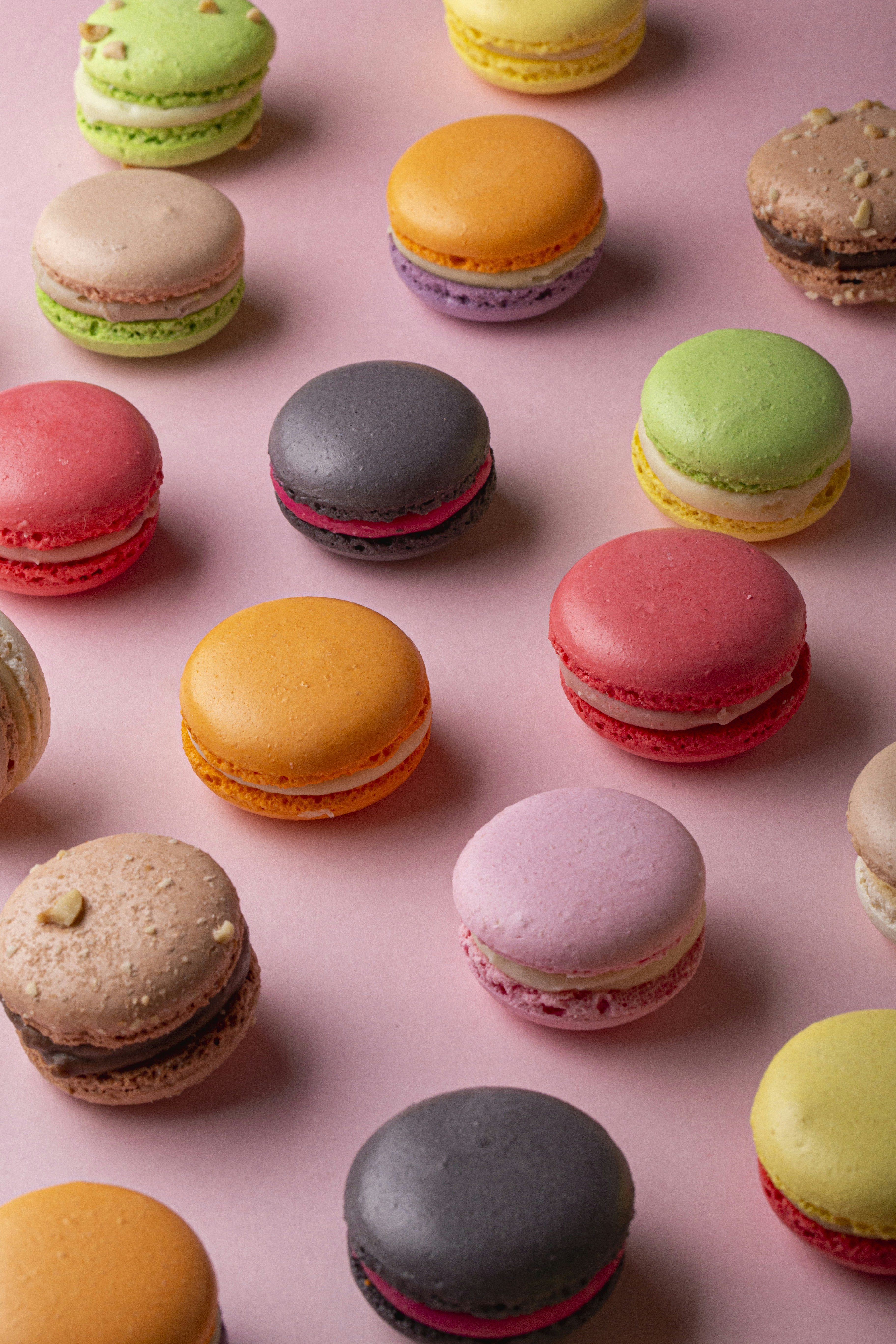 A table topped with lots of different colored macaroons photo – Free ...