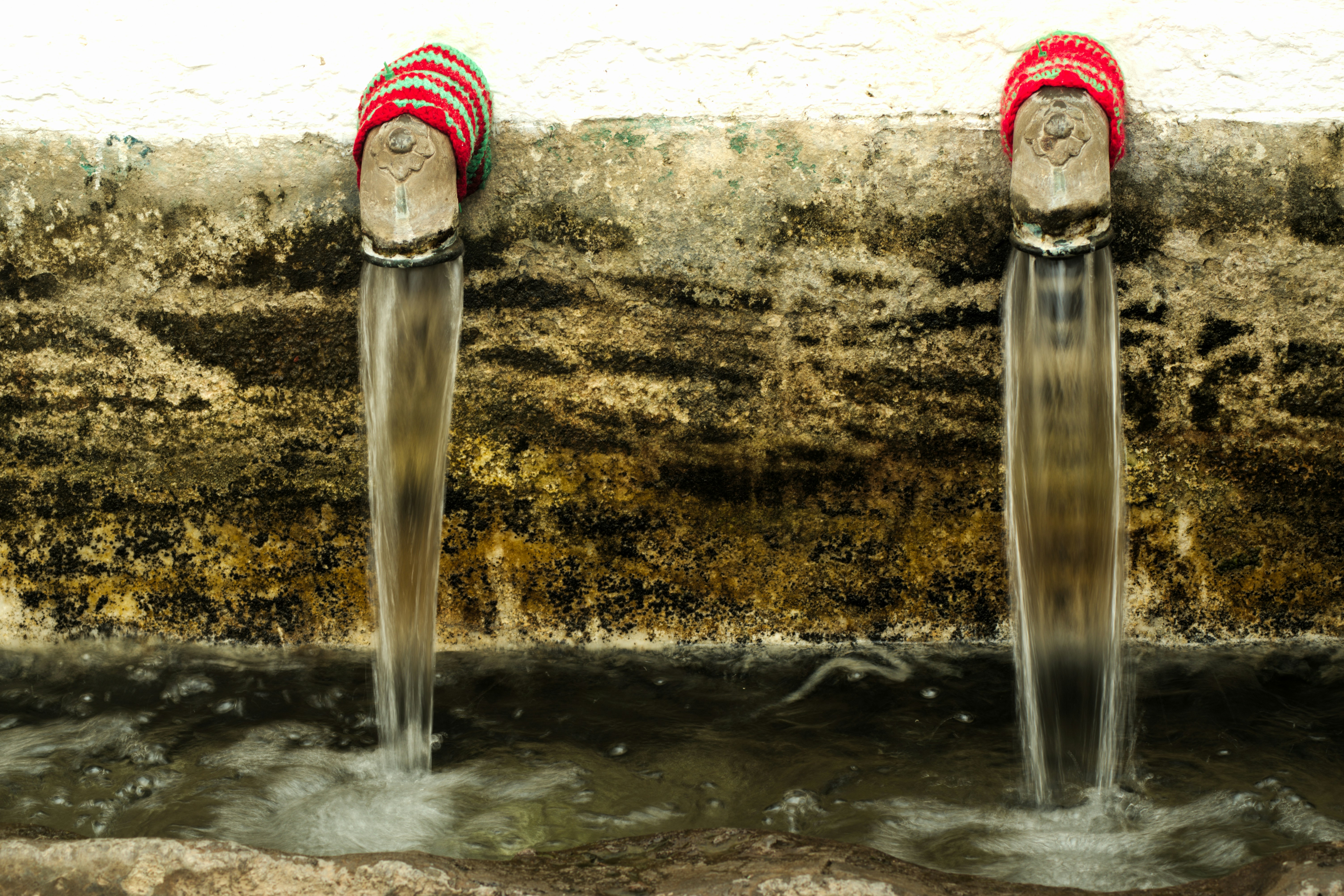 A couple of water spewing out of a wall photo – Free Fuenteheridos ...