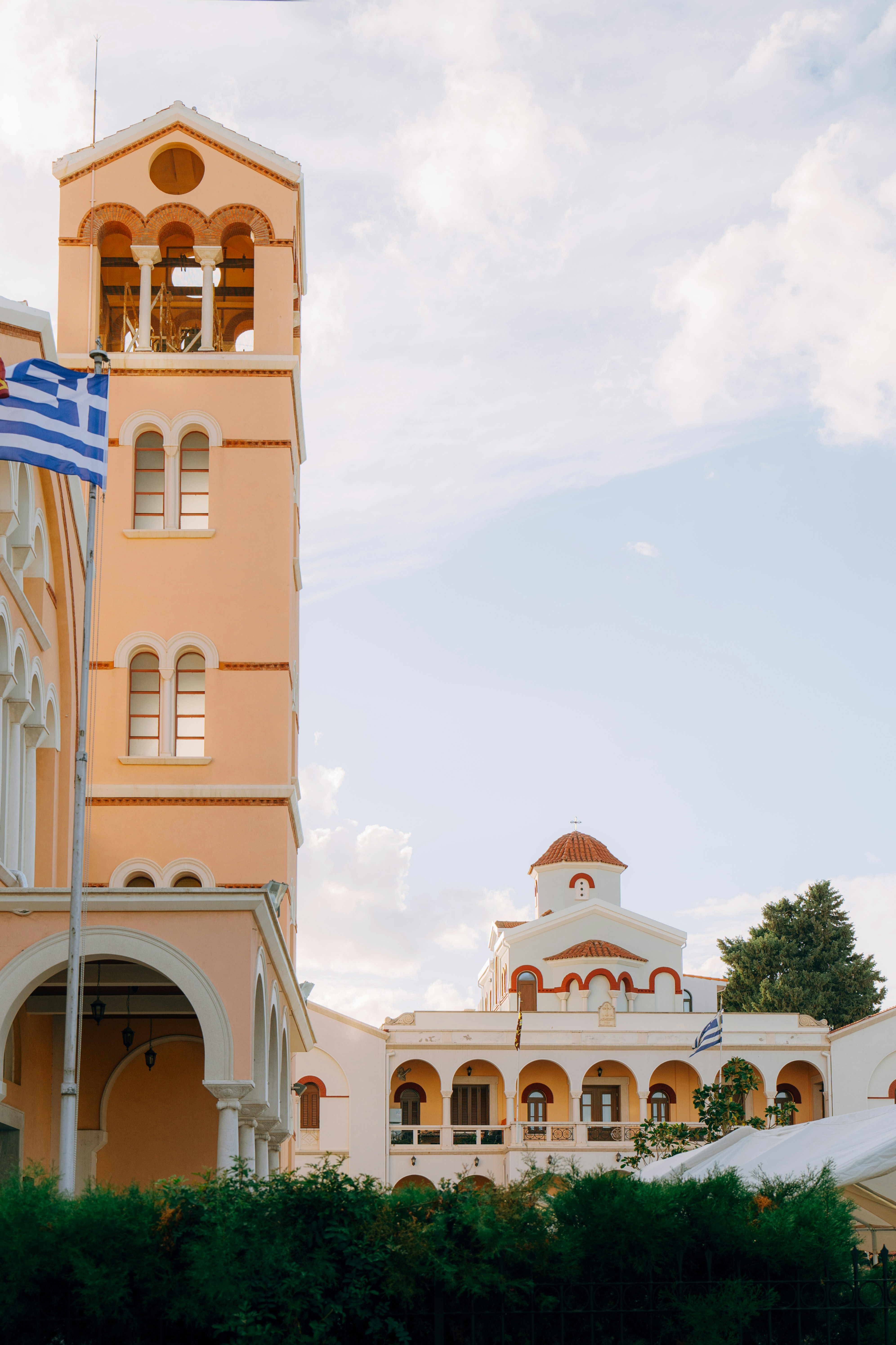 A tall building with a flag on top of it photo – Free Cyprus Image on ...