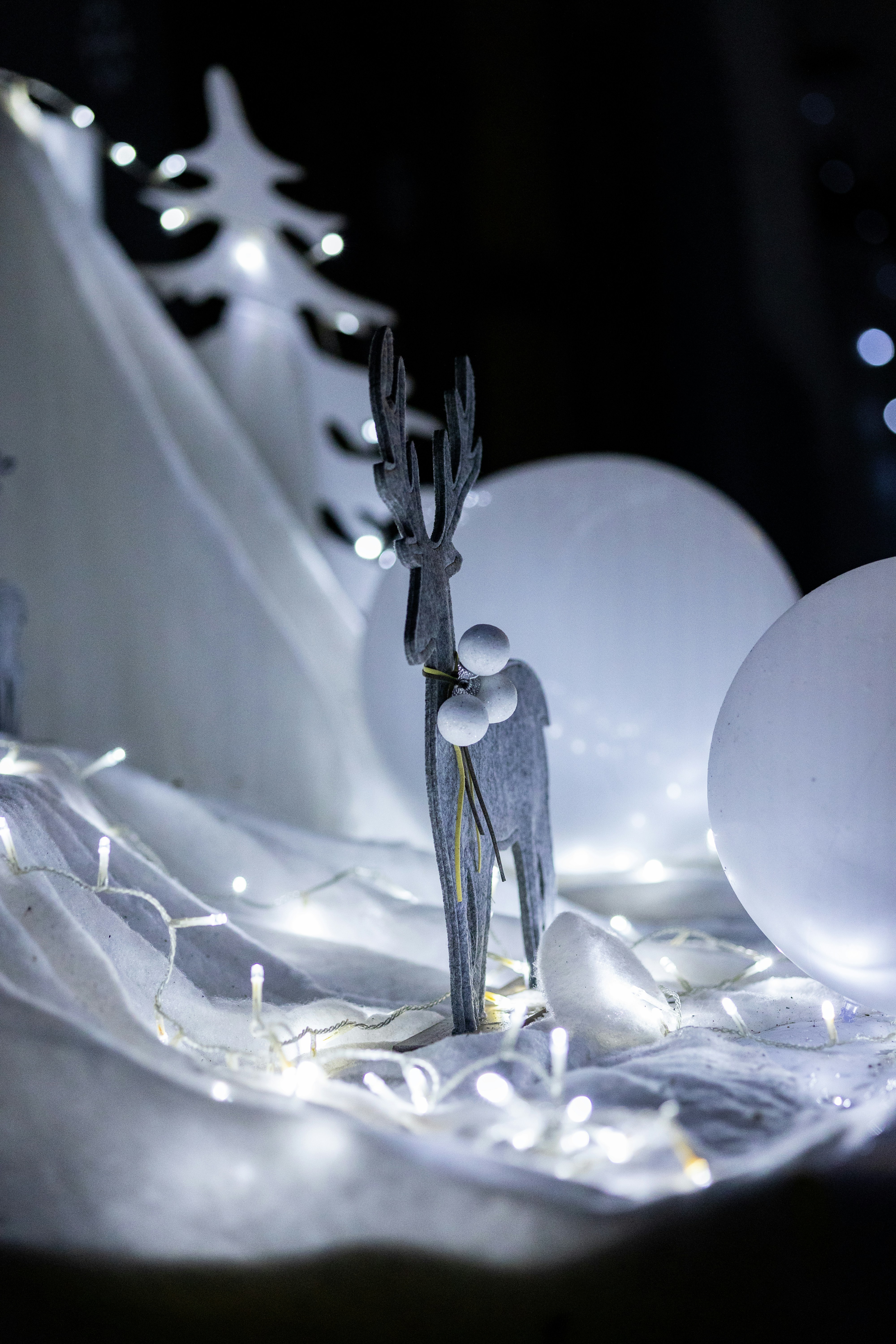 Snow-Dusted Silhouettes in a Fairy-Lit Snowfield