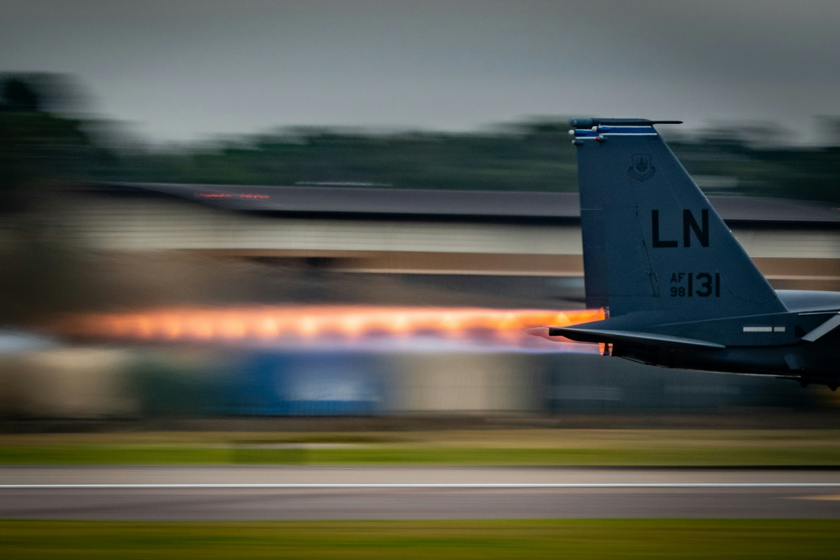 A fighter jet taking off from an airport runway photo – Free Airplane ...