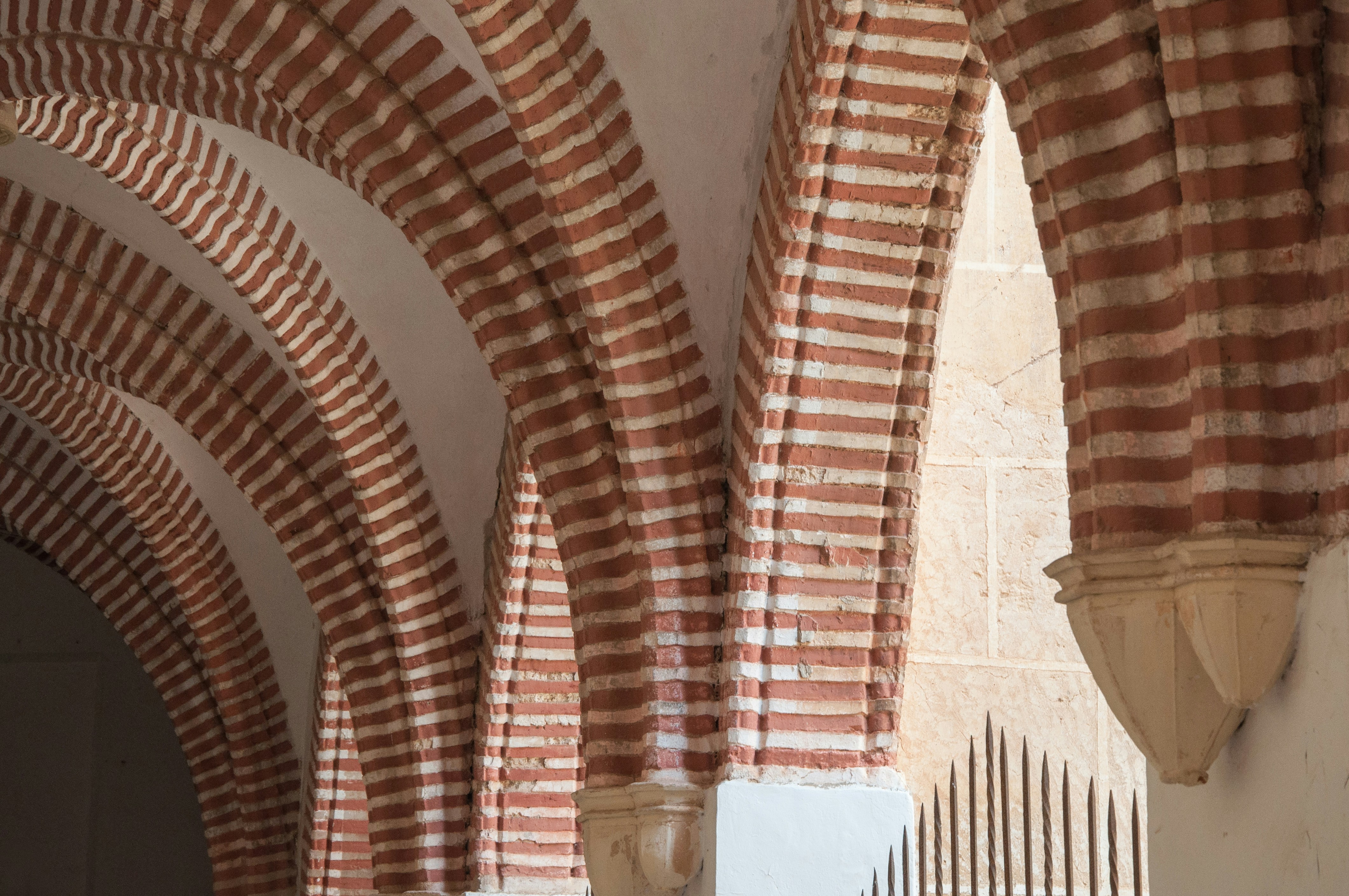 Crimson Rib Vaults: A Perspective Through Time in a Quiet Cloister