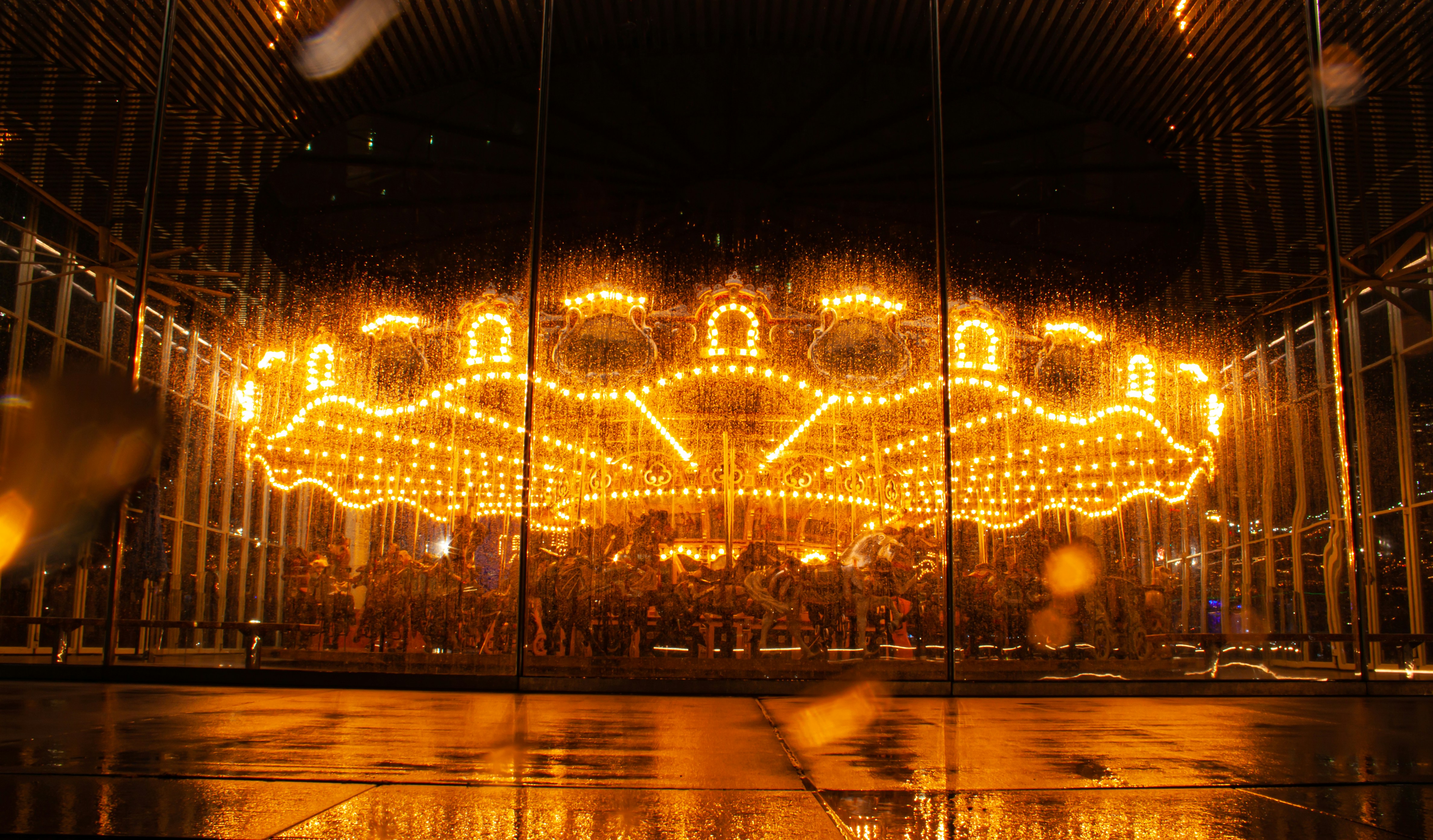 A reflection of a carnival ride at night photo – Free Building Image on ...