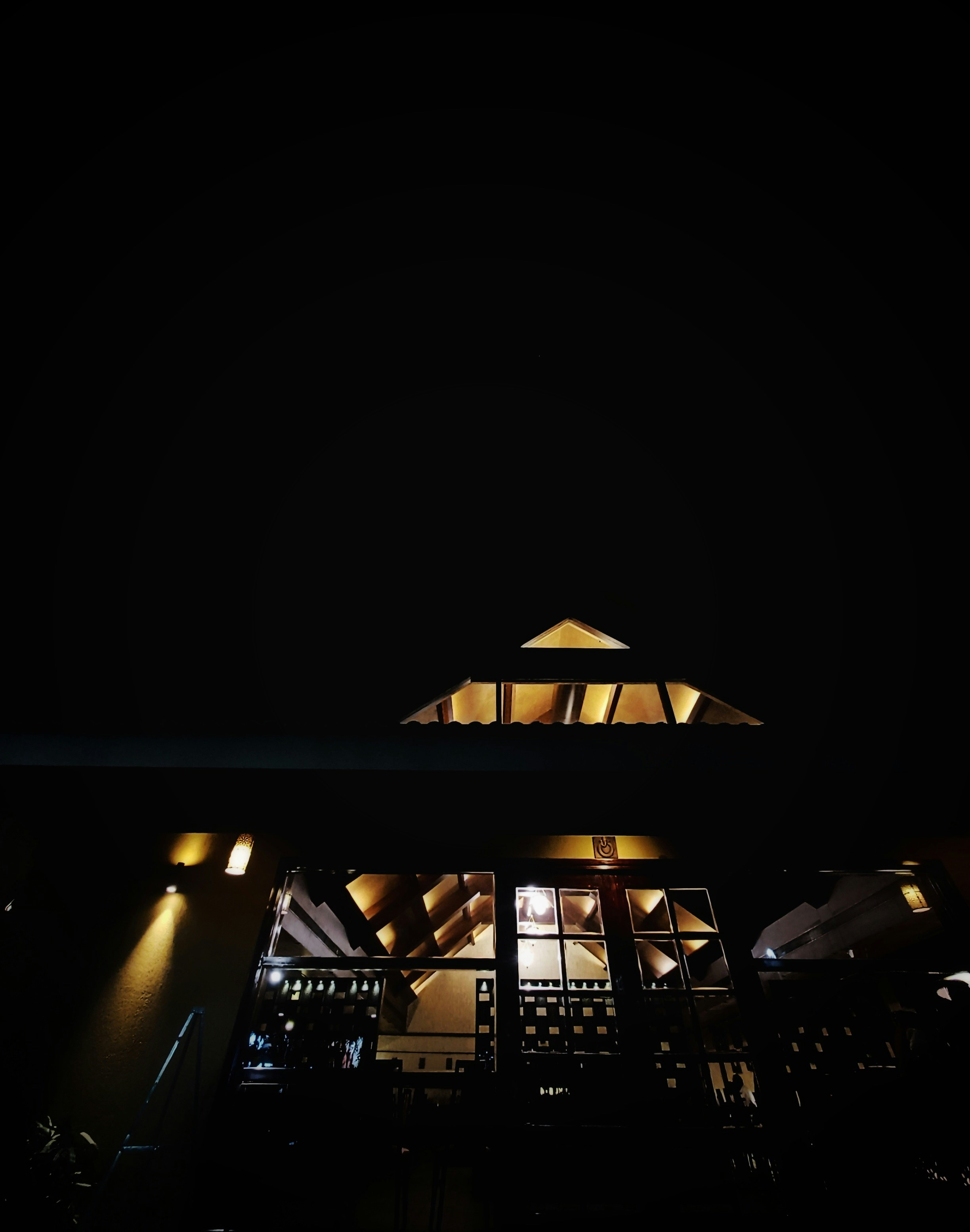 a building lit up at night in the dark