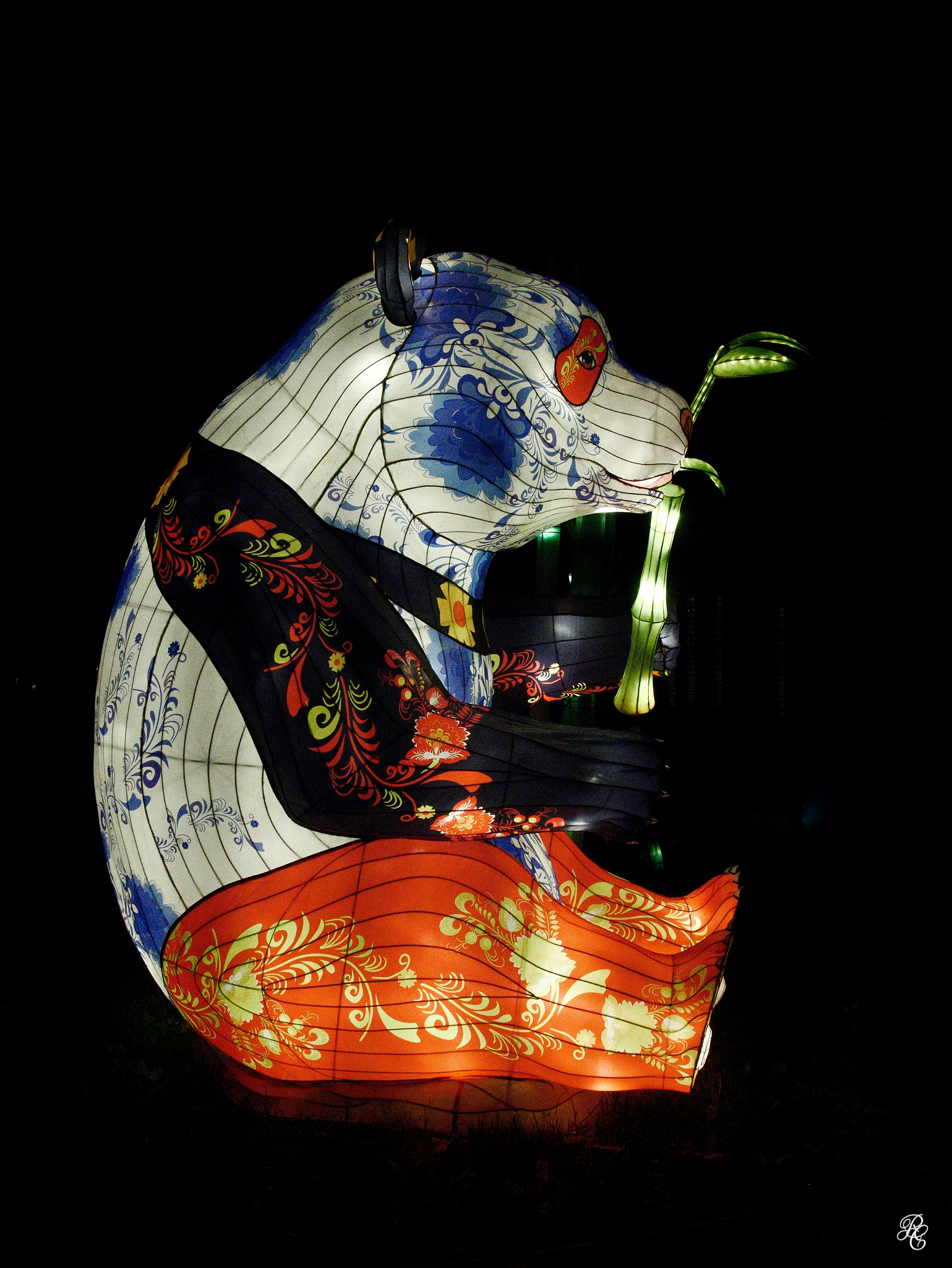 Porcelain Panda Lantern Draped in Floral Silk at Night