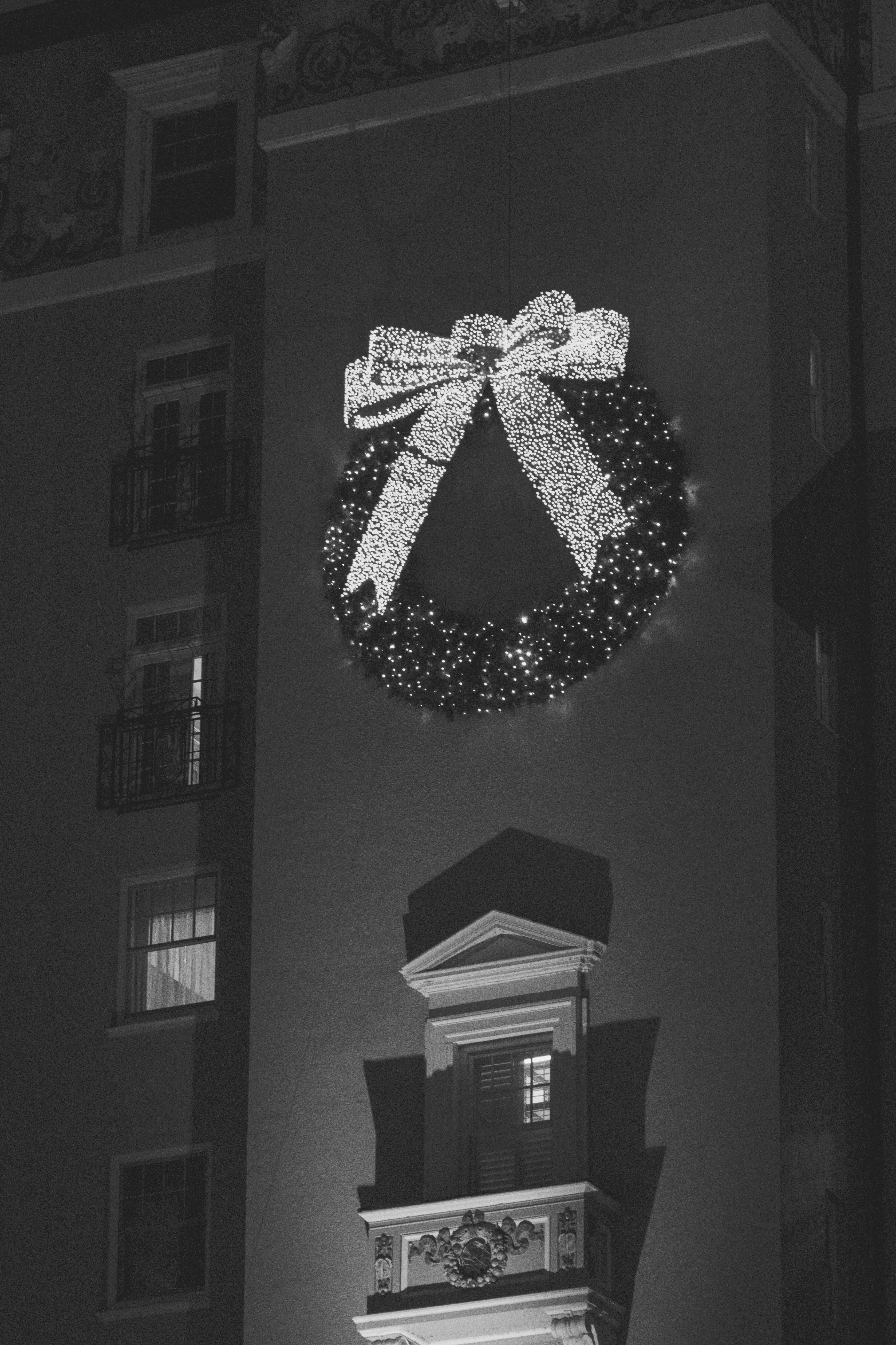 Wreath of Light Over a Historic Facade