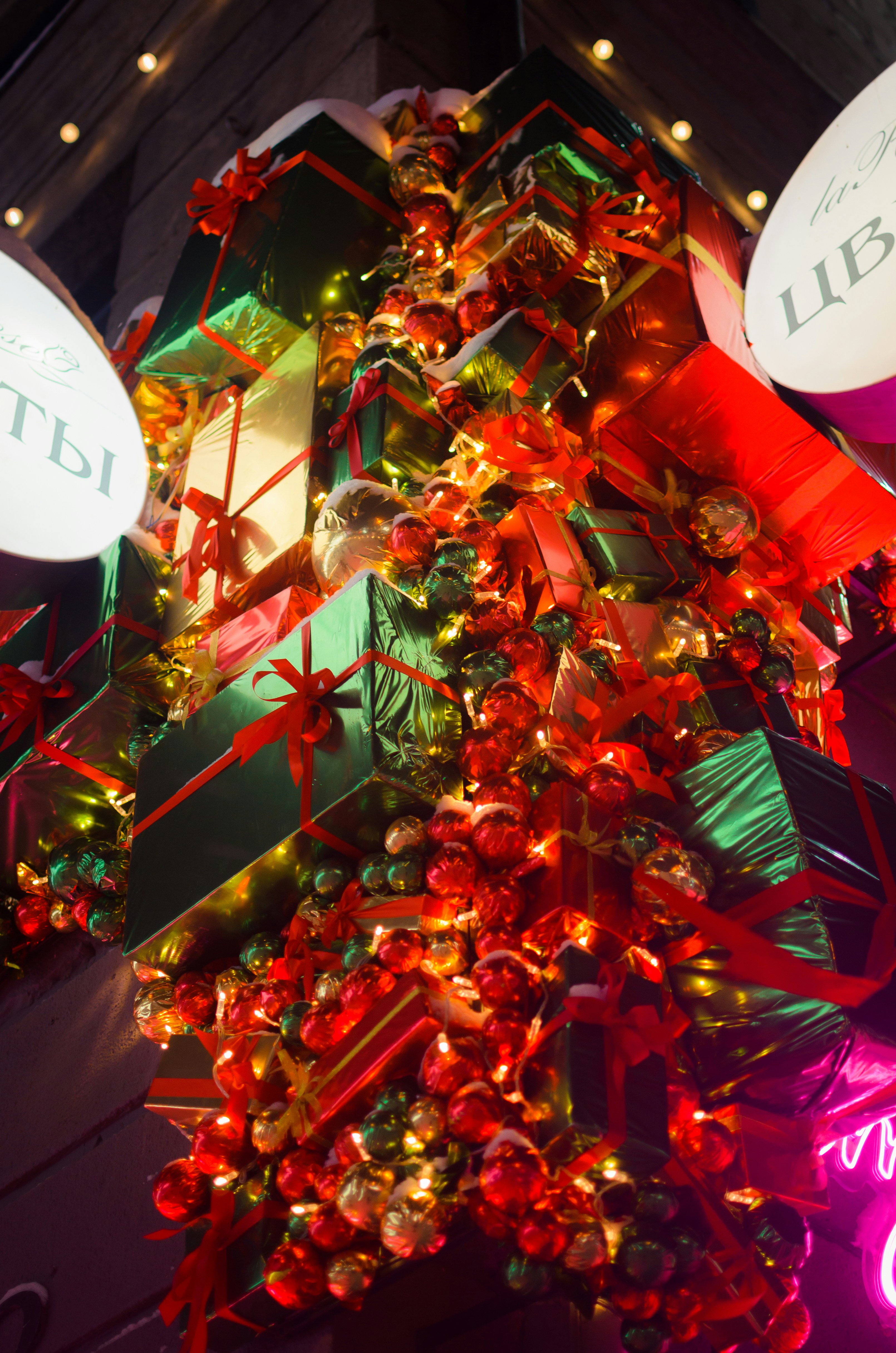Neon Gift Cascade: A Tower of Wrapped Presents