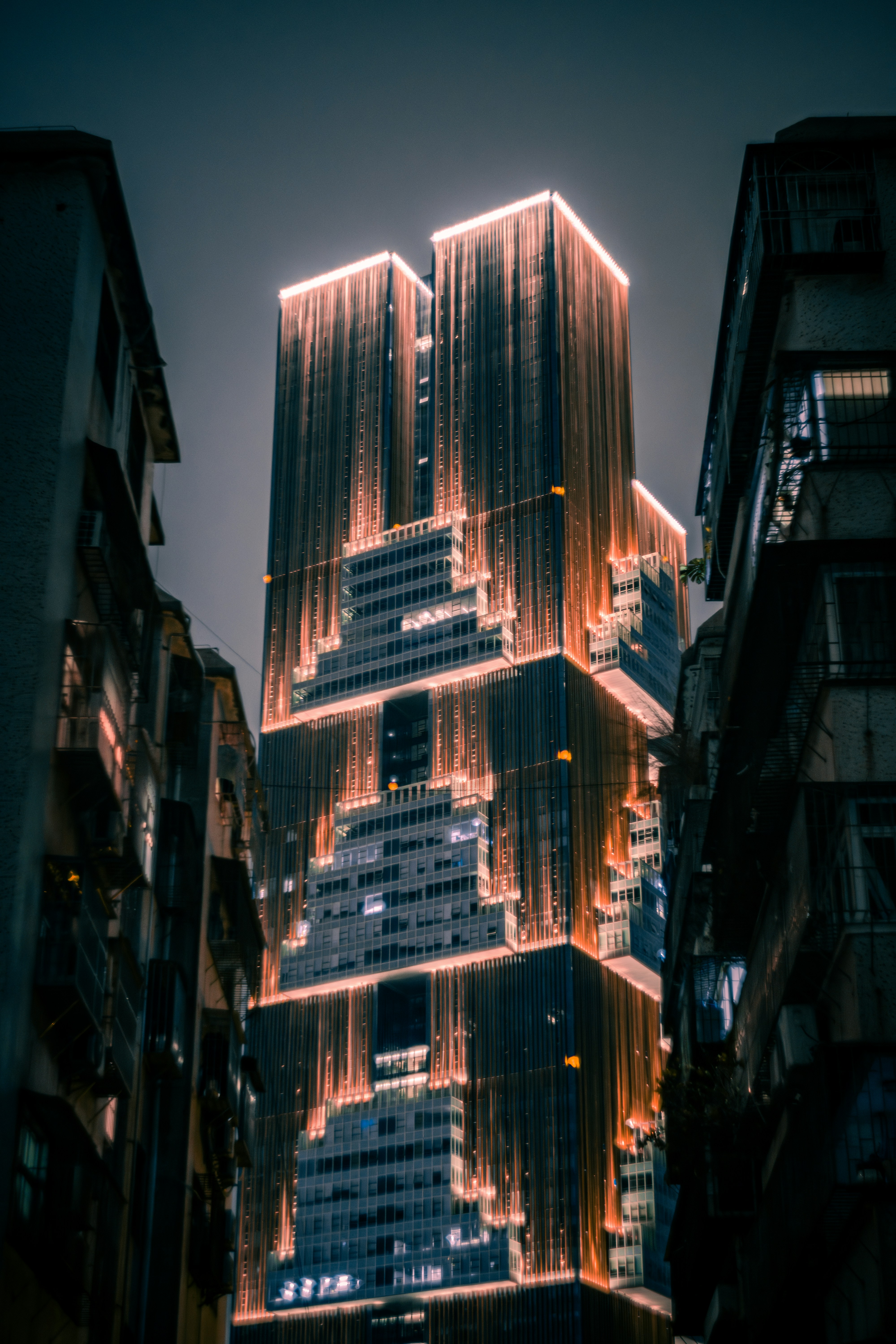 Cyberpunk's skyscrapers | a very tall building with a lot of lights on it