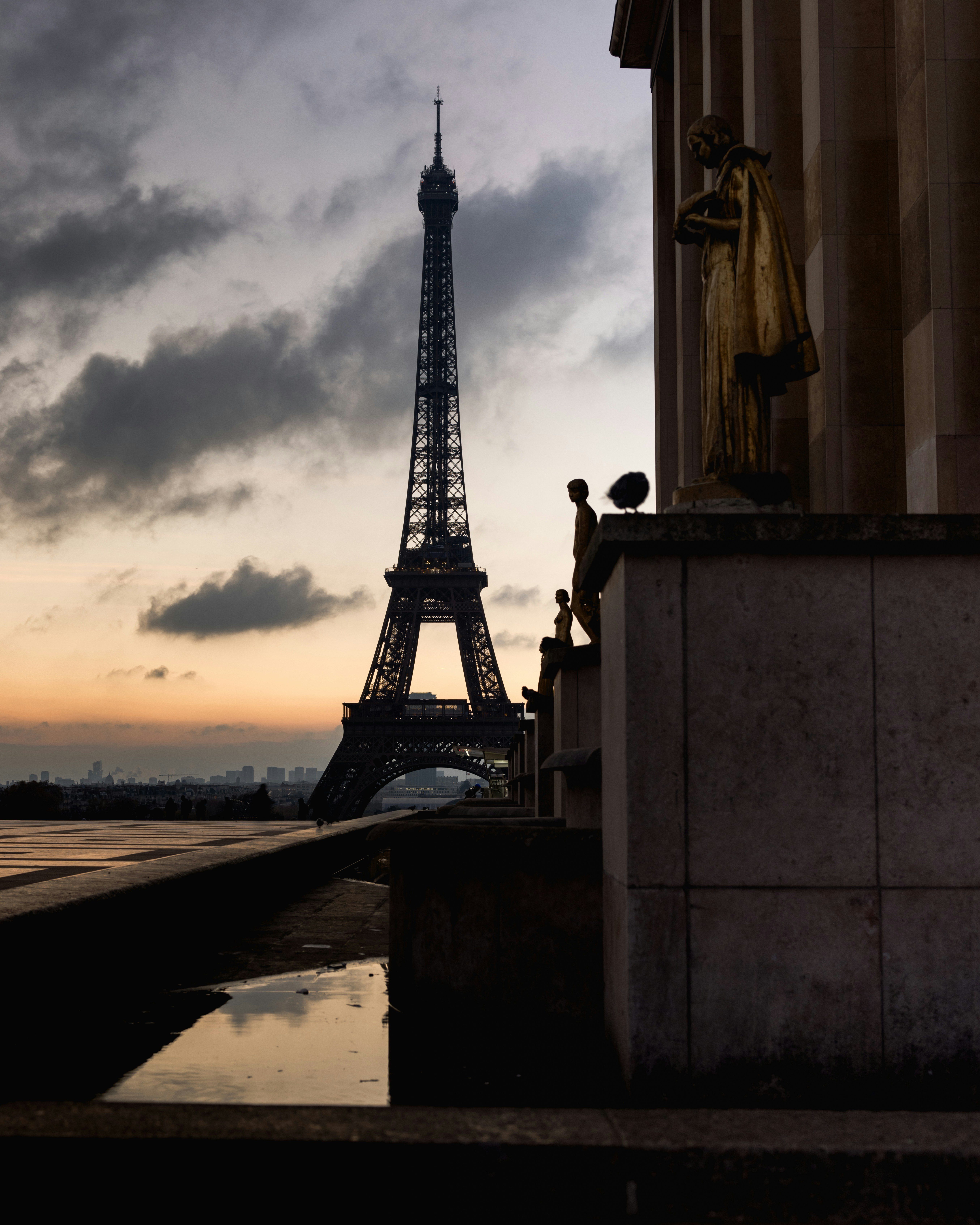 Dusk Over the Seine: Eiffel Tower Silhouette by the Statues