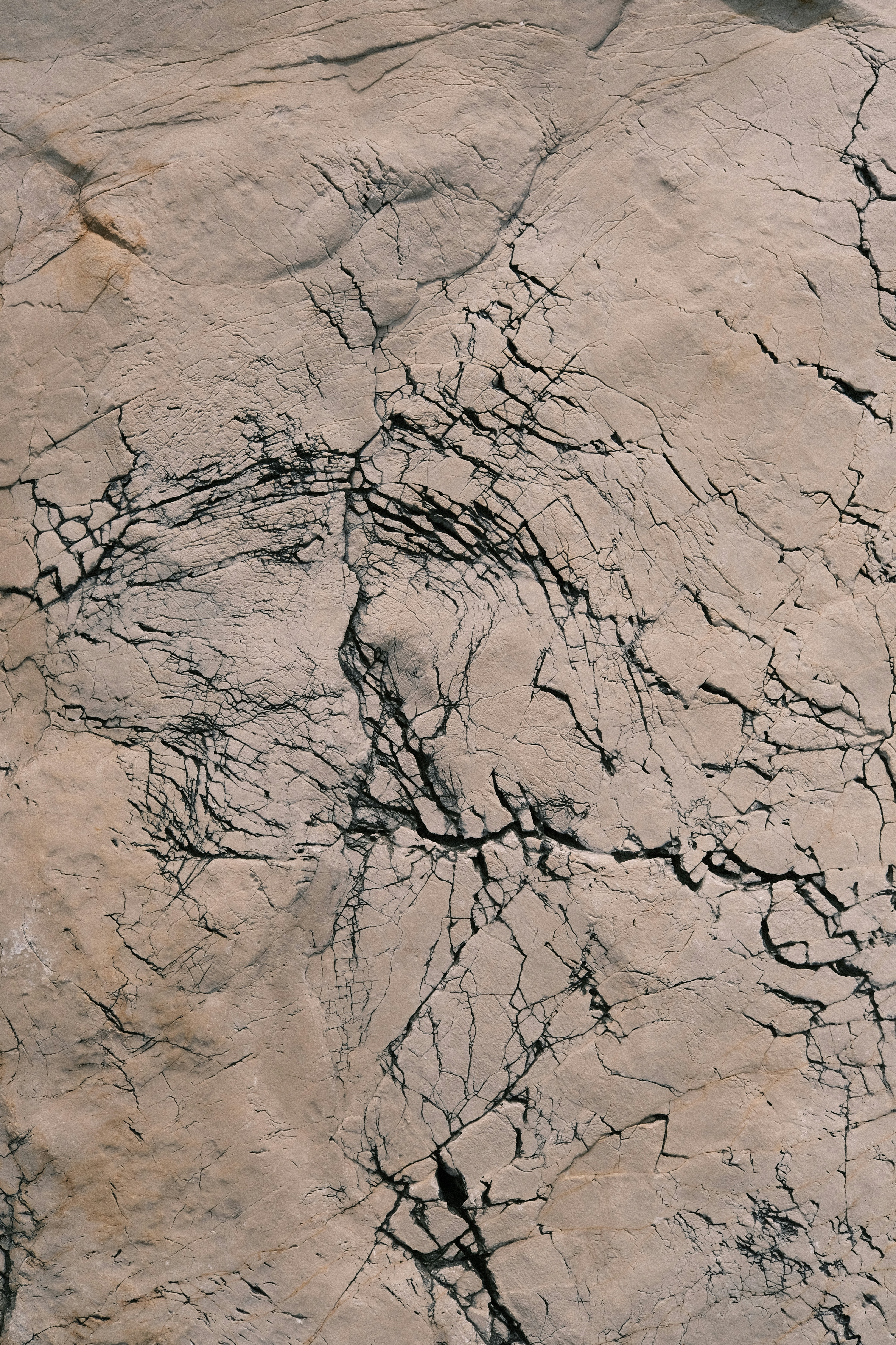 A close up of a rock with cracks in it photo – Free Rock Image on Unsplash