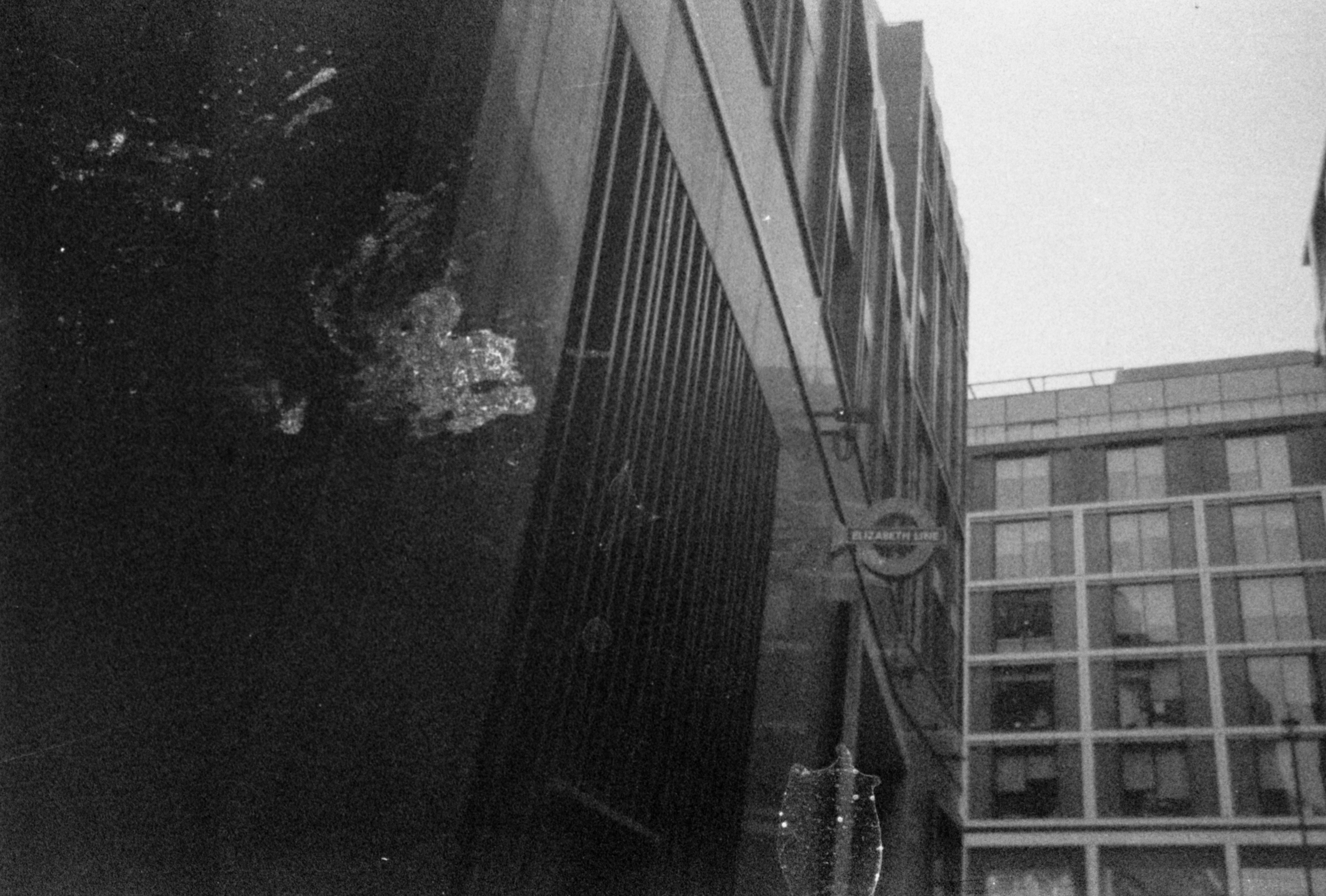 A black and white photo of a tall building photo – Free Grey Image on ...