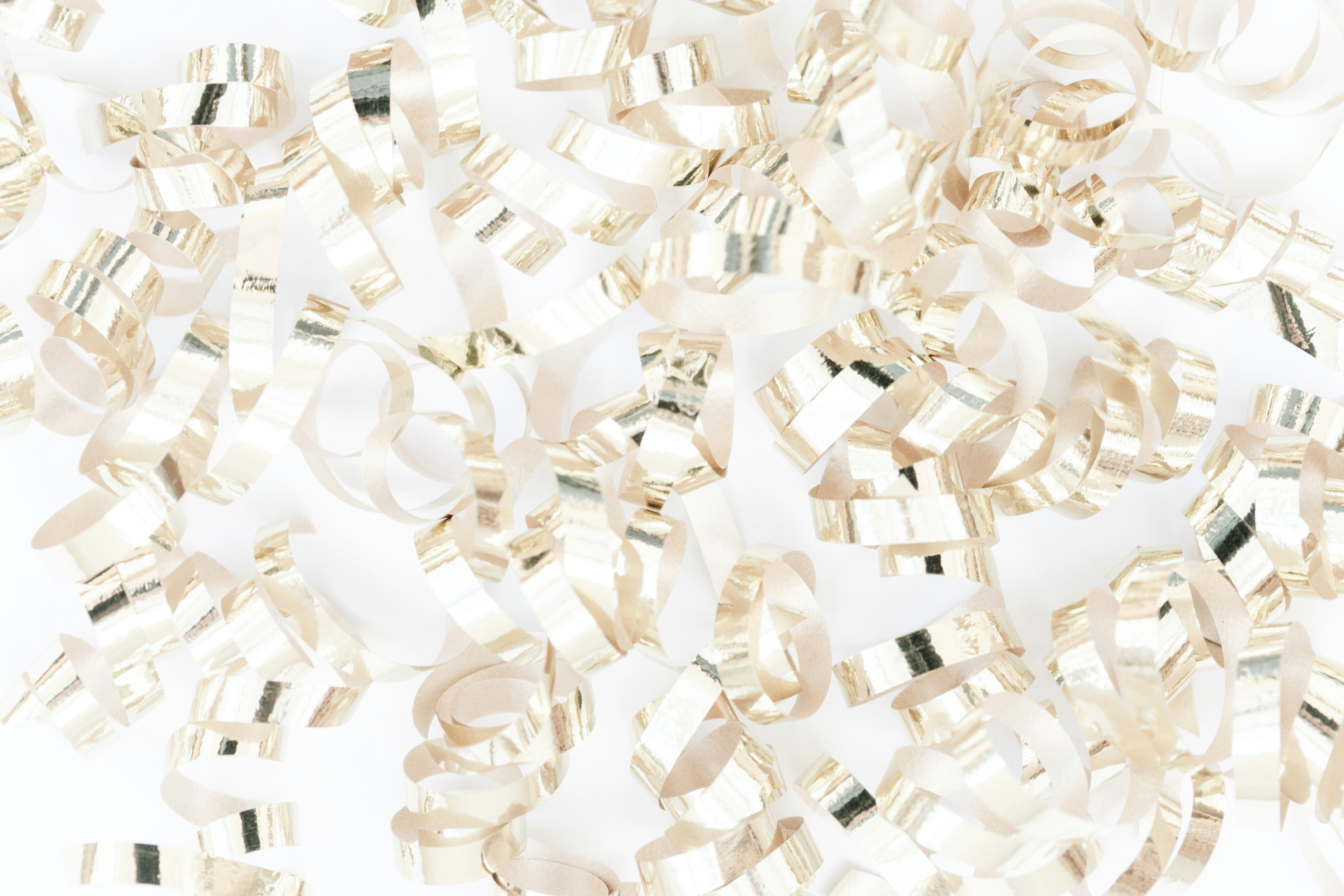 A pile of shiny ribbons on a white background photo – Free White Image ...