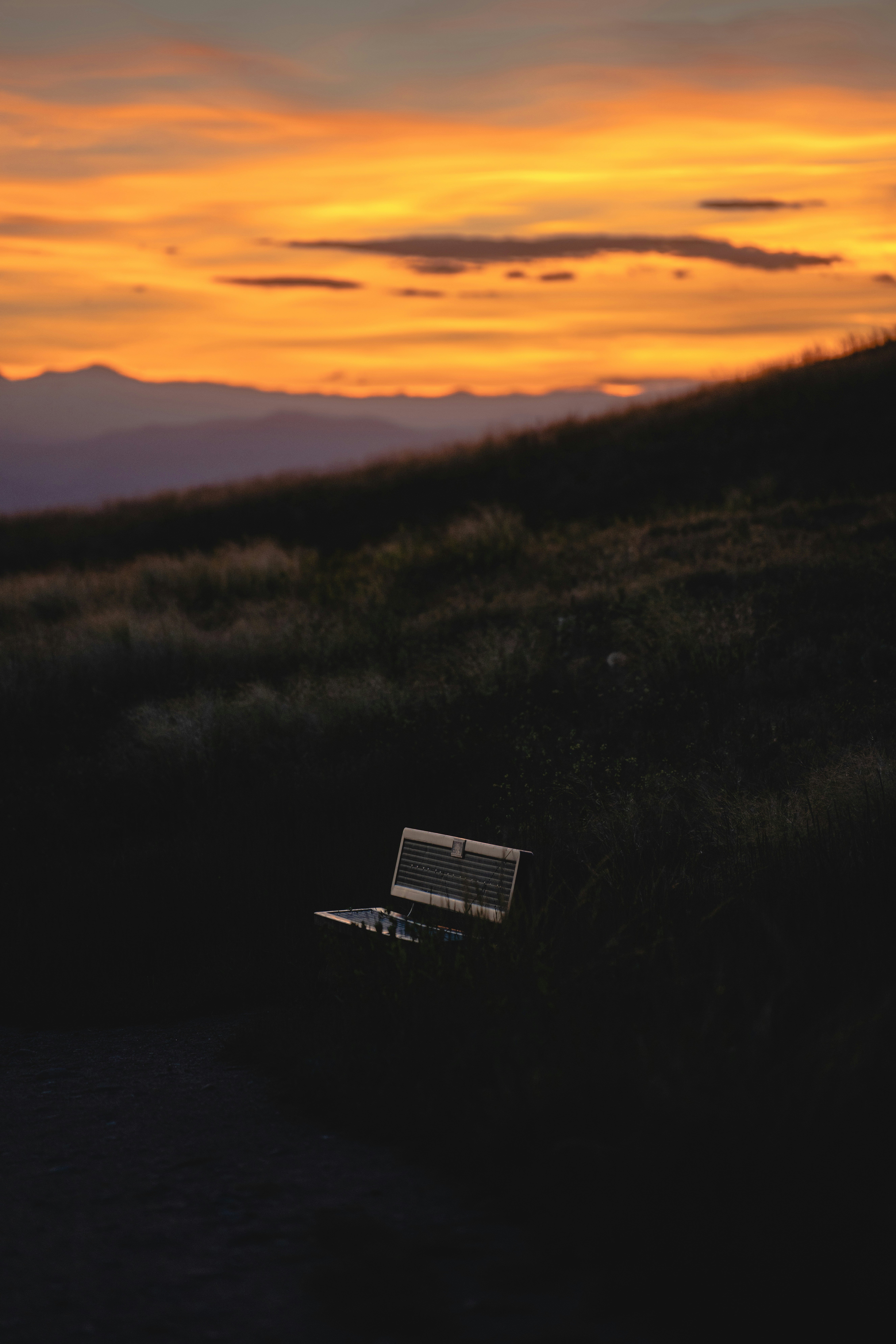 Bench at the Edge of Ember: A Sunset on the Quiet Ridge