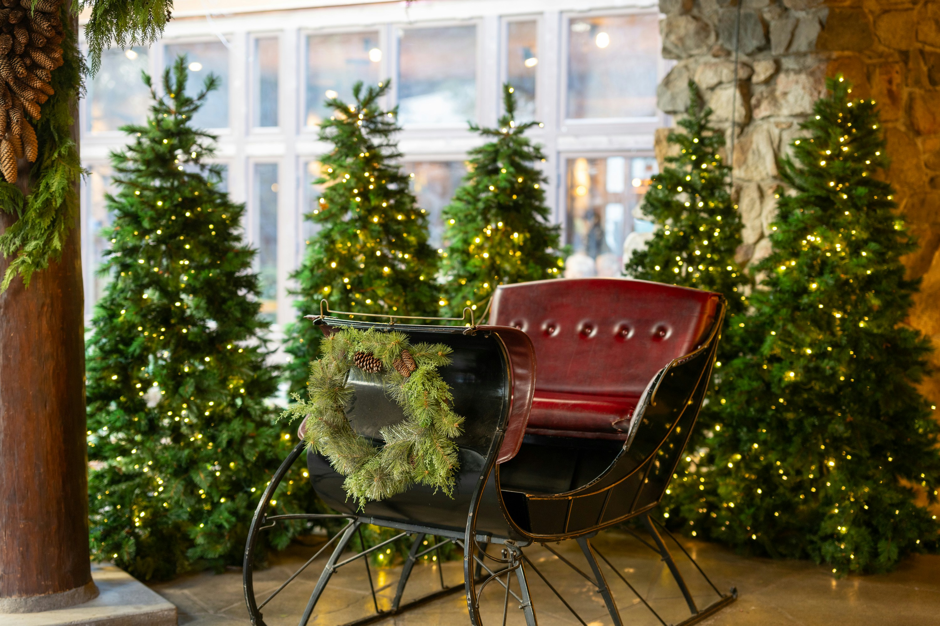 A red chair sitting in front of a christmas tree photo – Free The ...