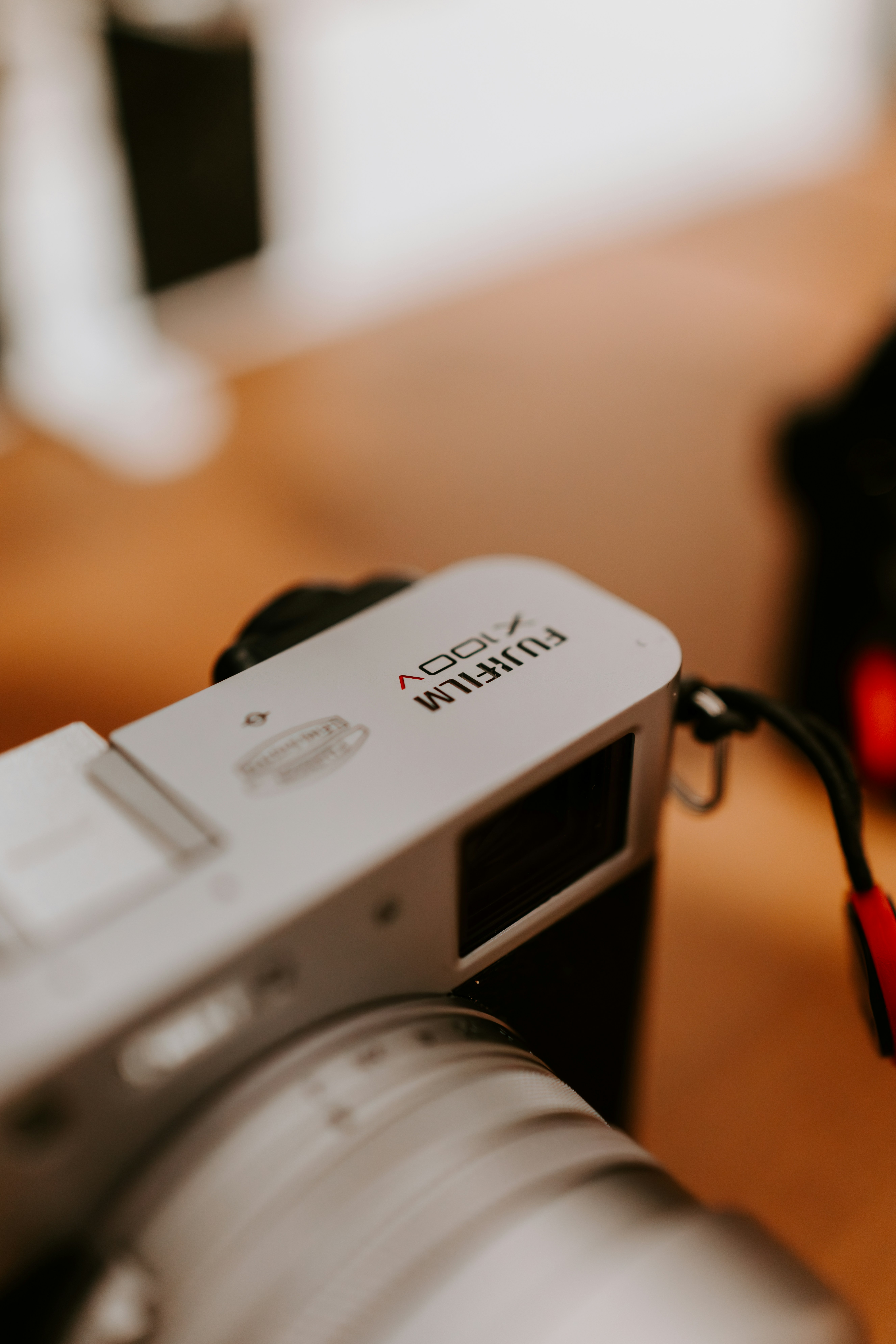 A close up of a camera on a table photo – Free Fujifilm x100v Image on ...