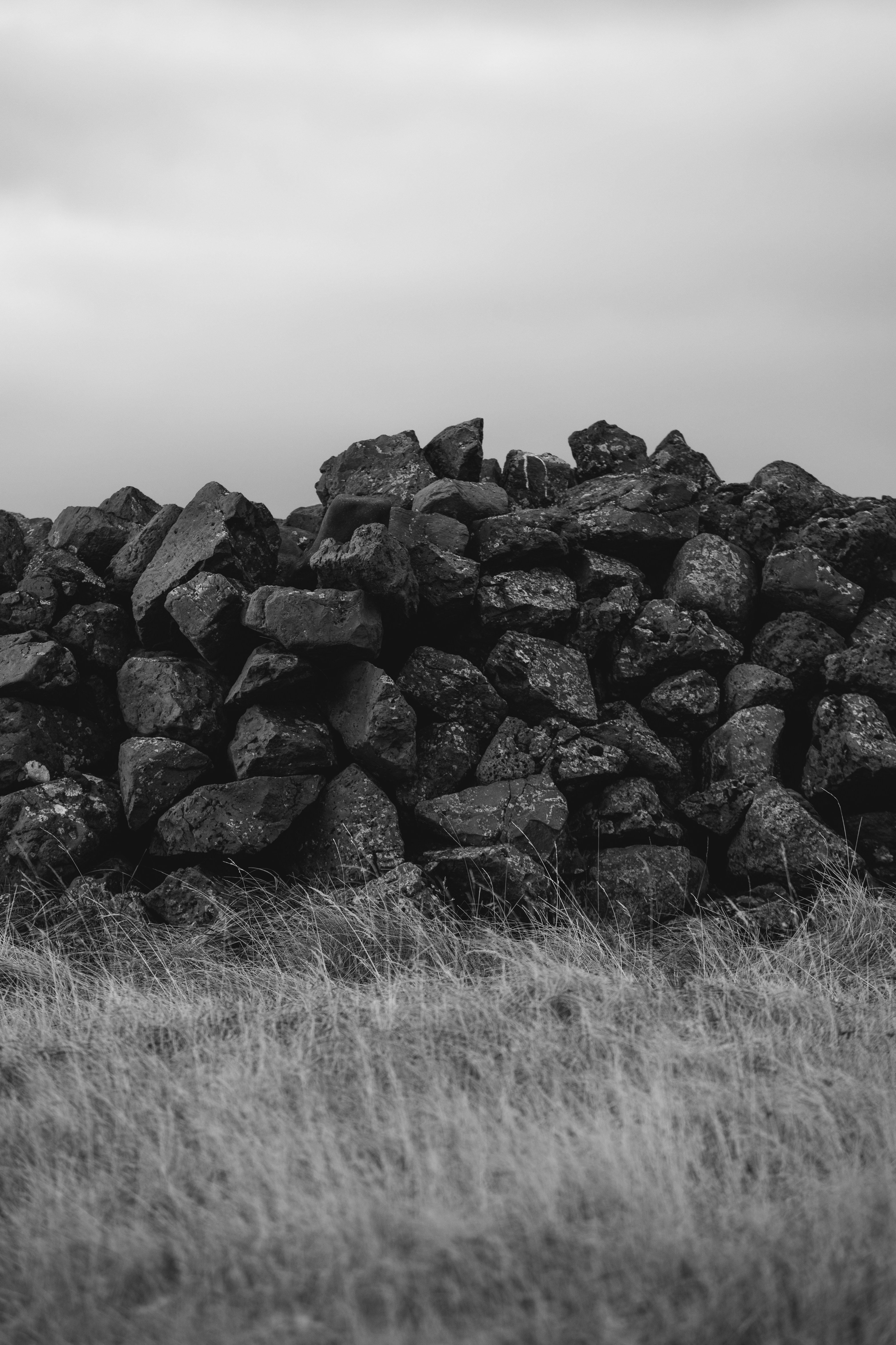 Monochrome Boulder Wall on a Windy Plain