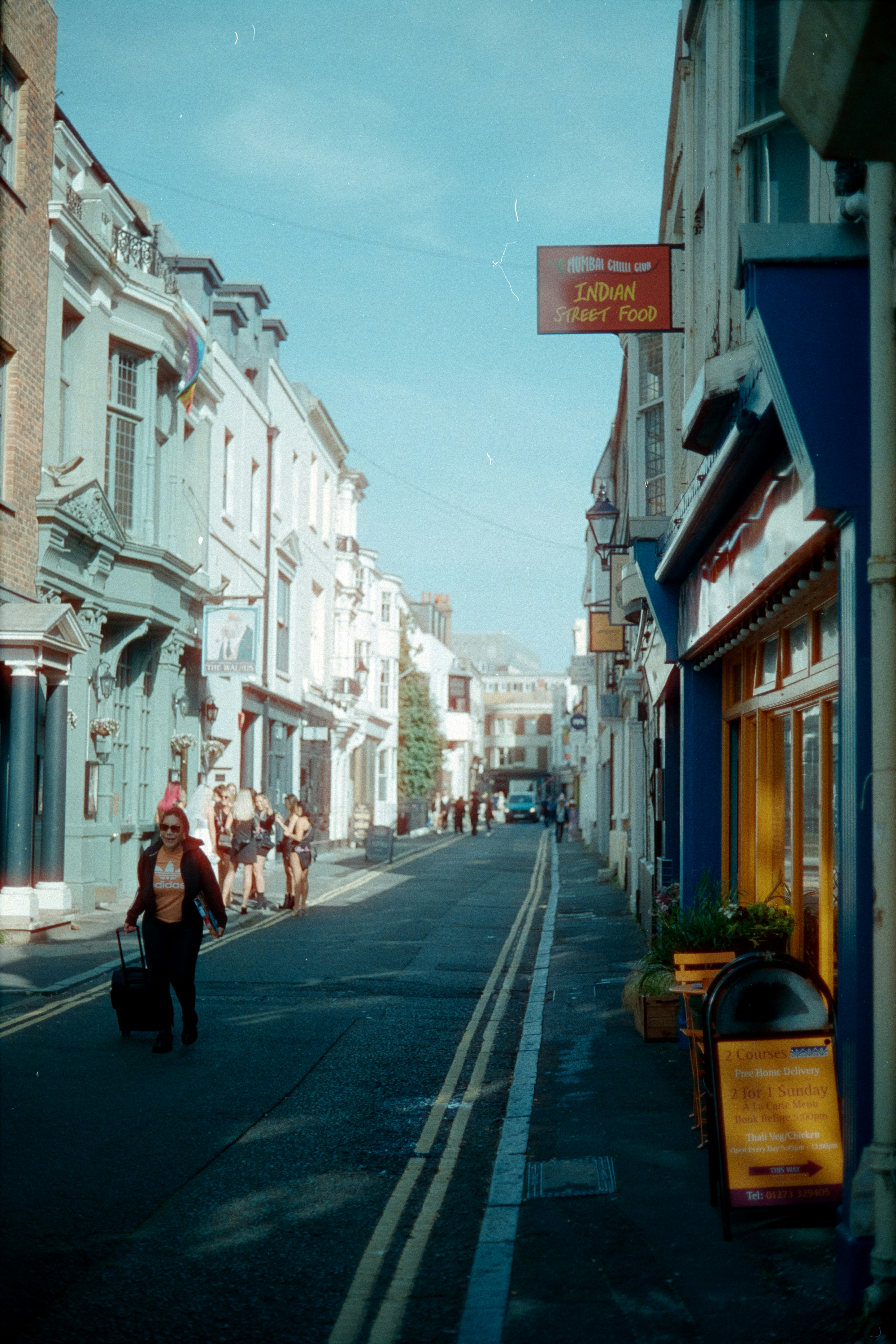 Sunlit Street in a Colorful Coastal Town