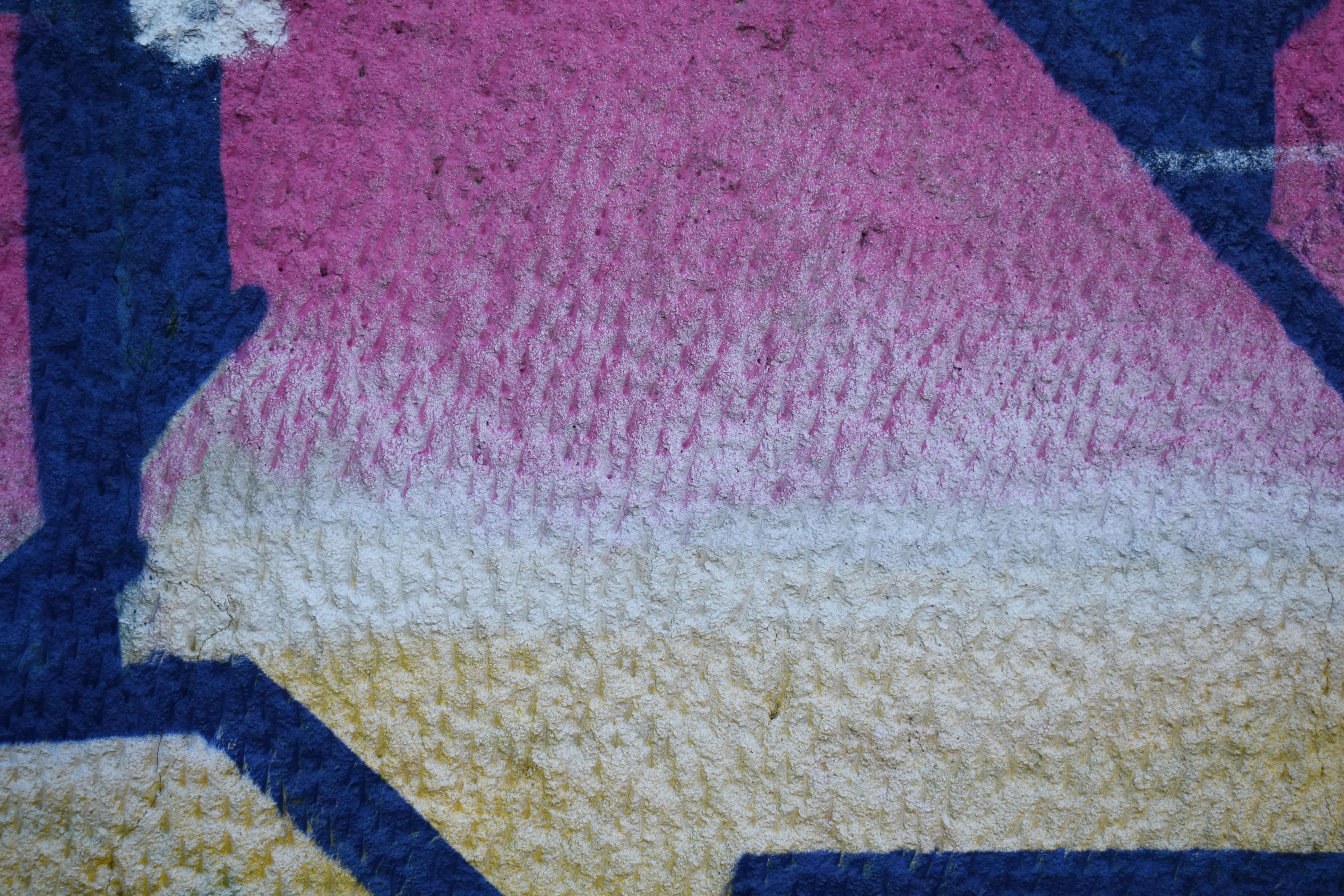 Cracked Colors: Abstract Graffiti Grain Under Urban Light