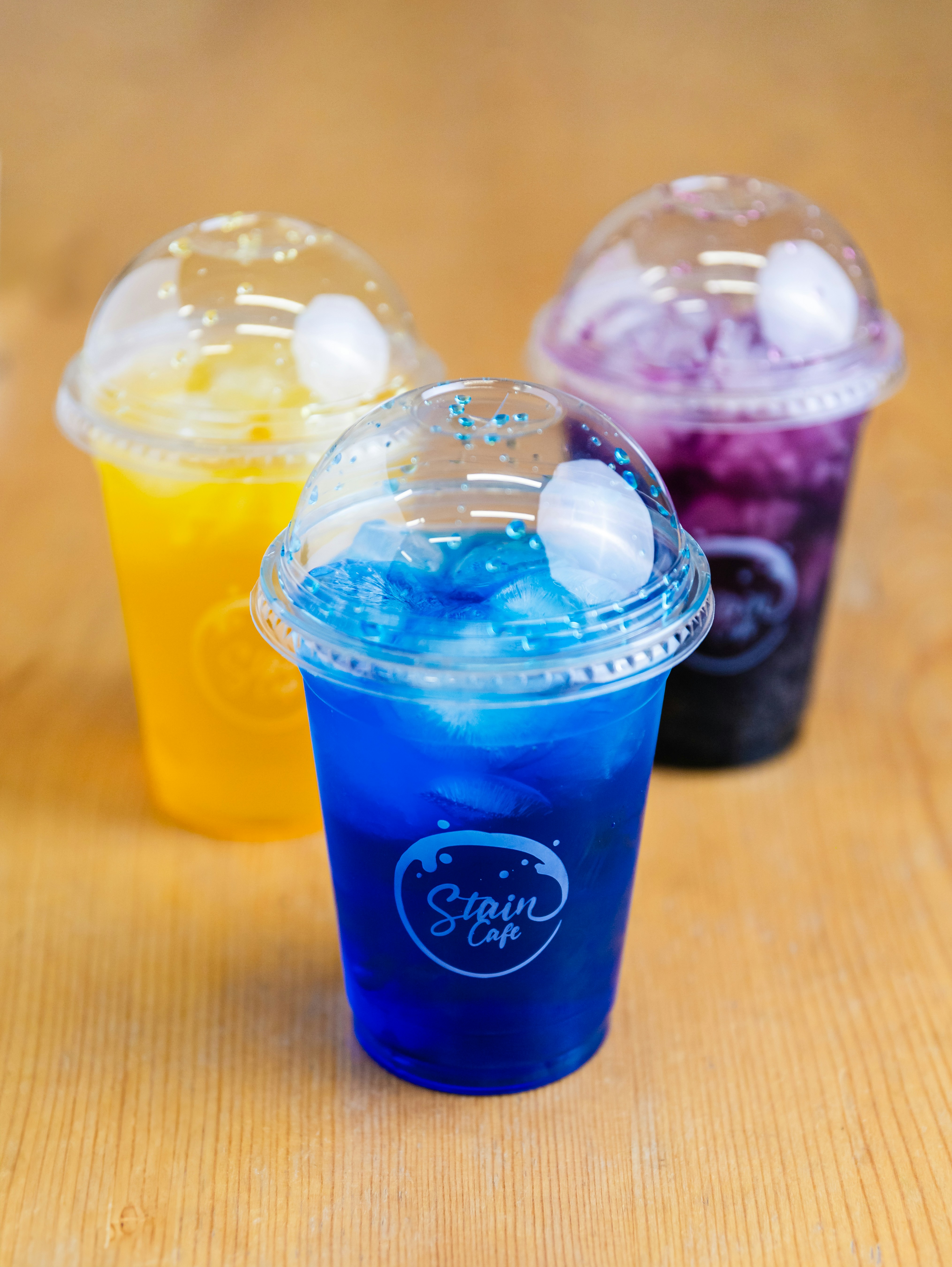 Three different colored drinks sitting on a table photo – Free Drink ...