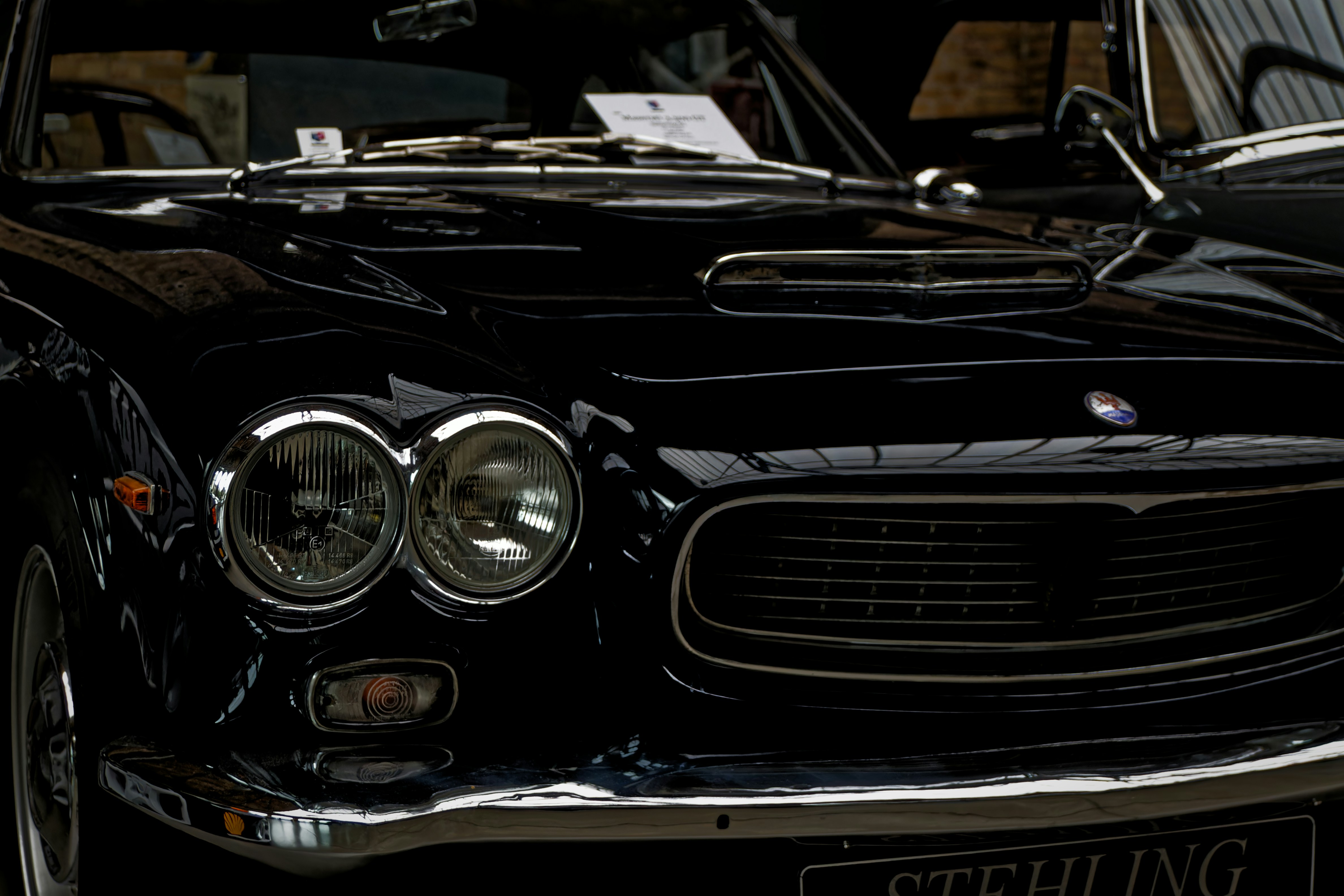 Midnight Grille Portrait: Twin Headlamps Framing a Classic Chrome Front