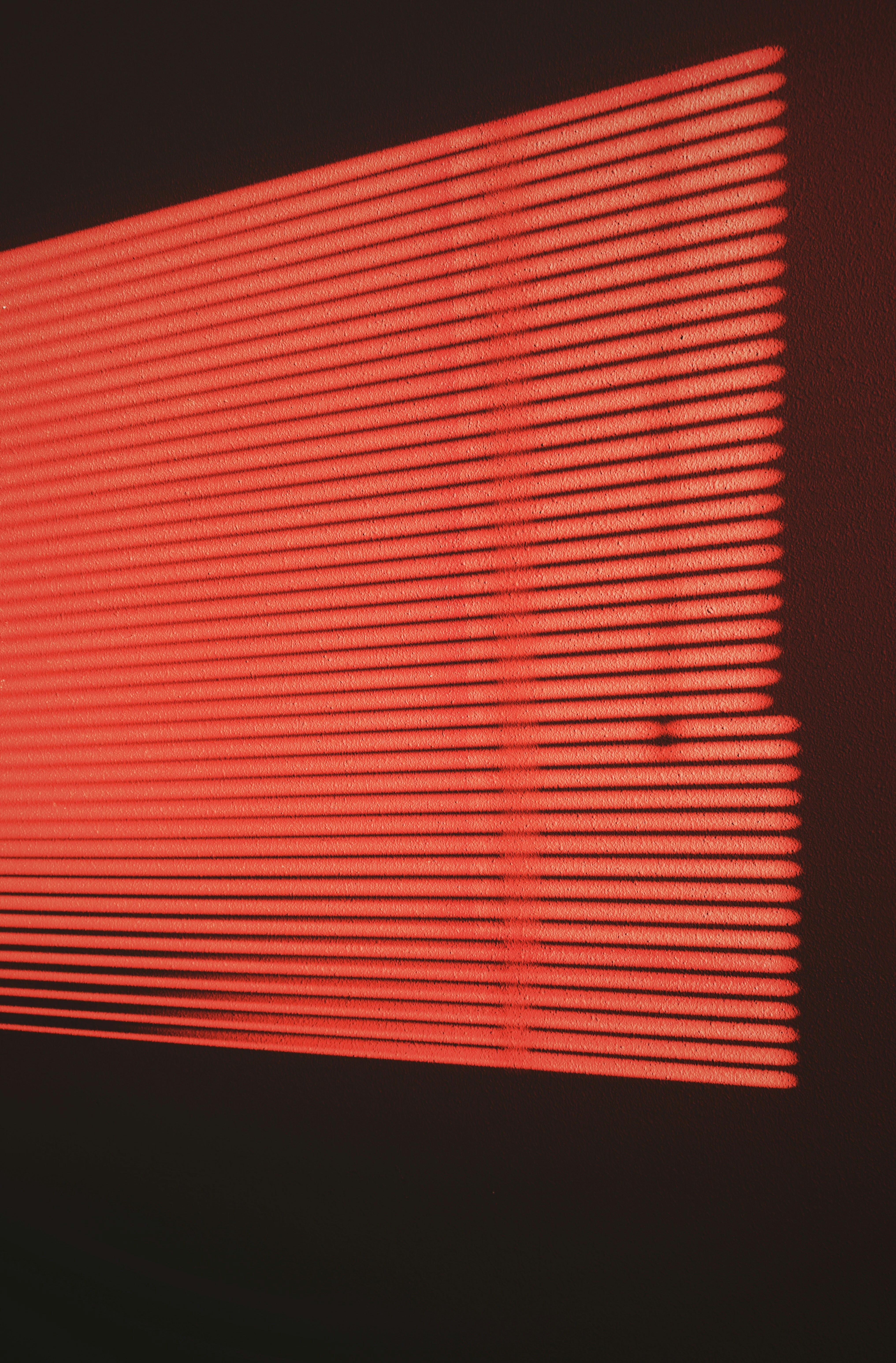 A close up of a window with red blinds photo – Free Curtain Image on ...