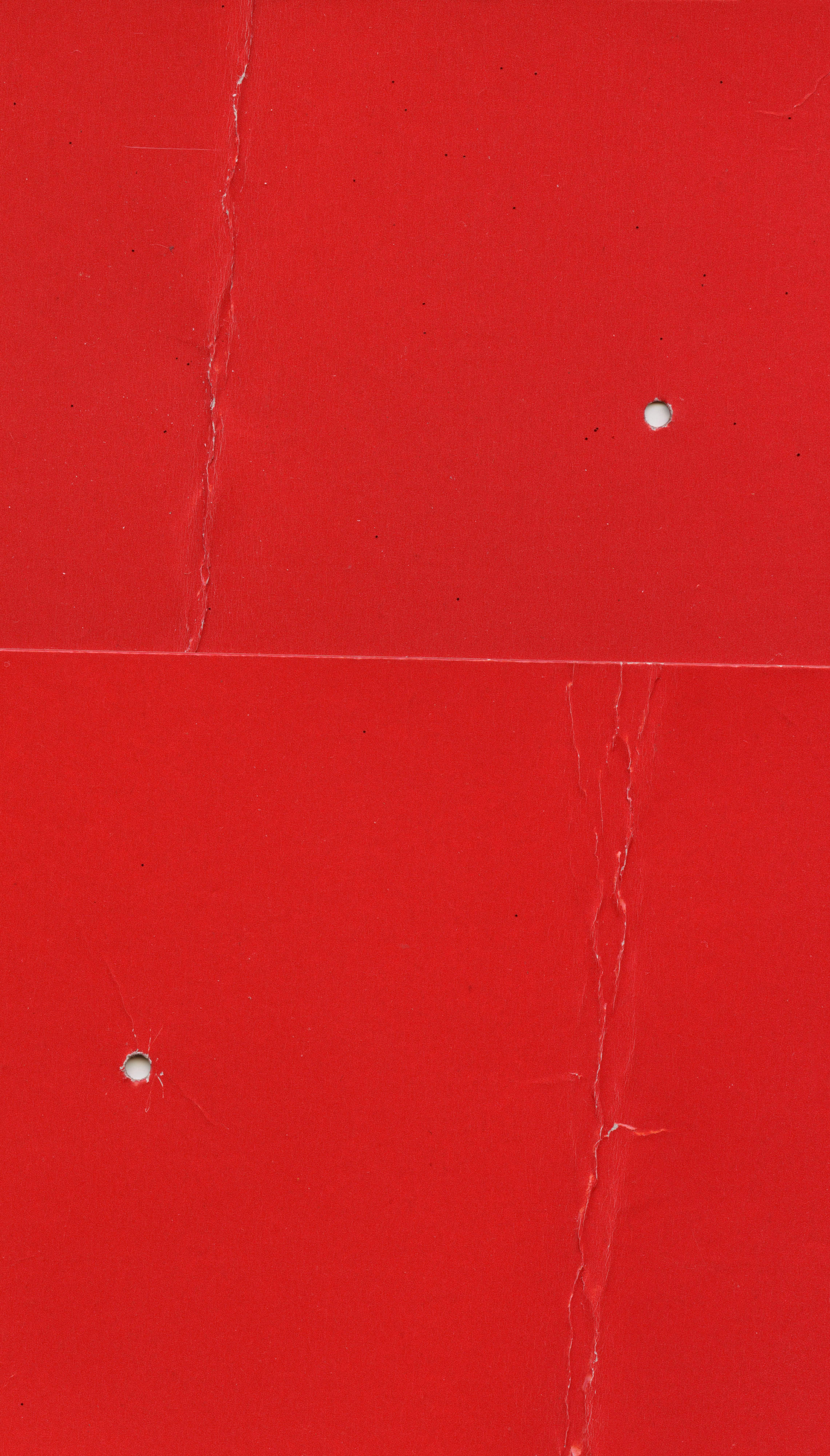 A close up of a red wall with holes in it photo – Free Paper Image on ...