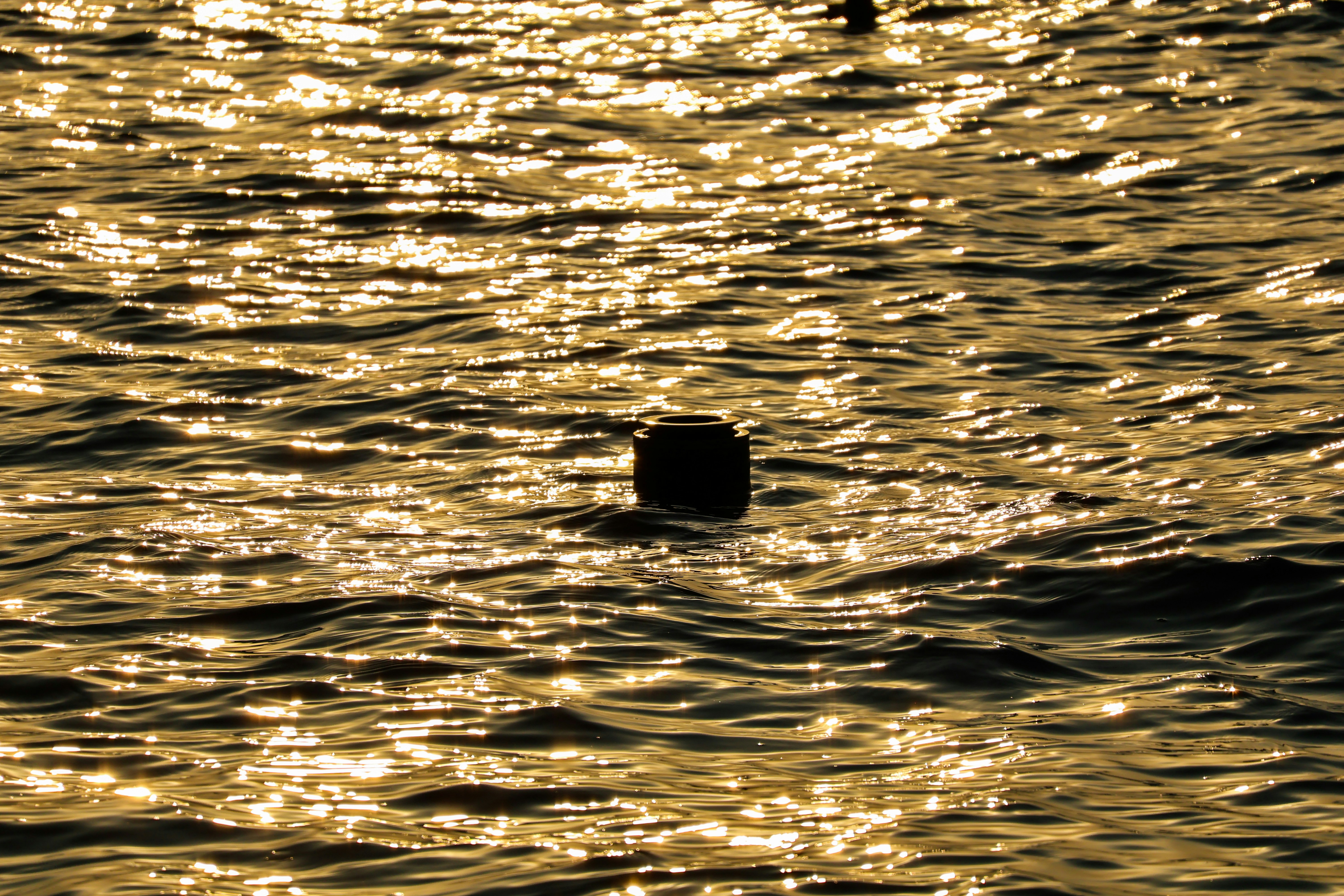 Glowing Buoy on a Sunlit Sea