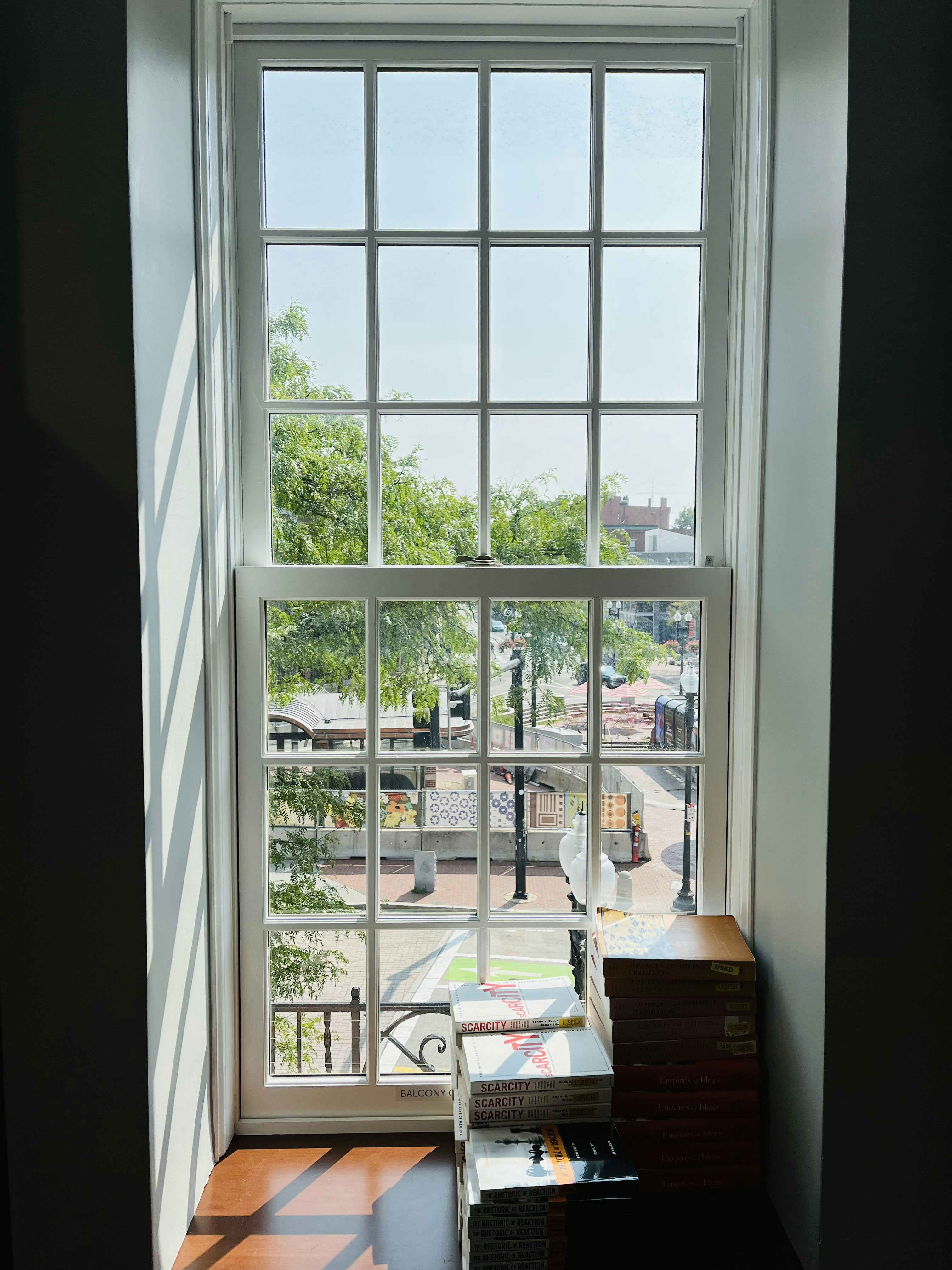 A window with a view of a street outside photo – Free Cambridge Image ...