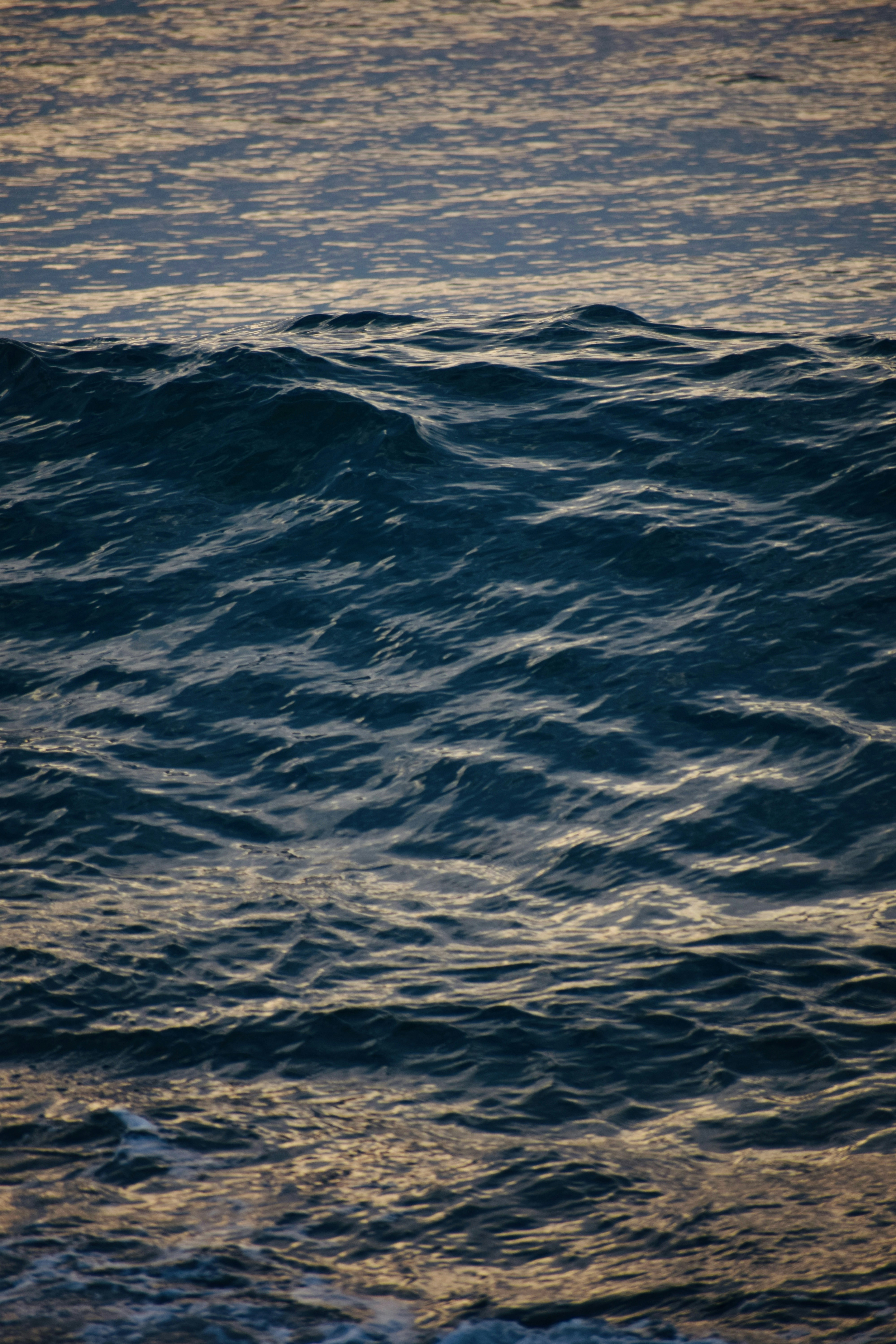 Evening Crest: Light Dances on a Quiet Sea