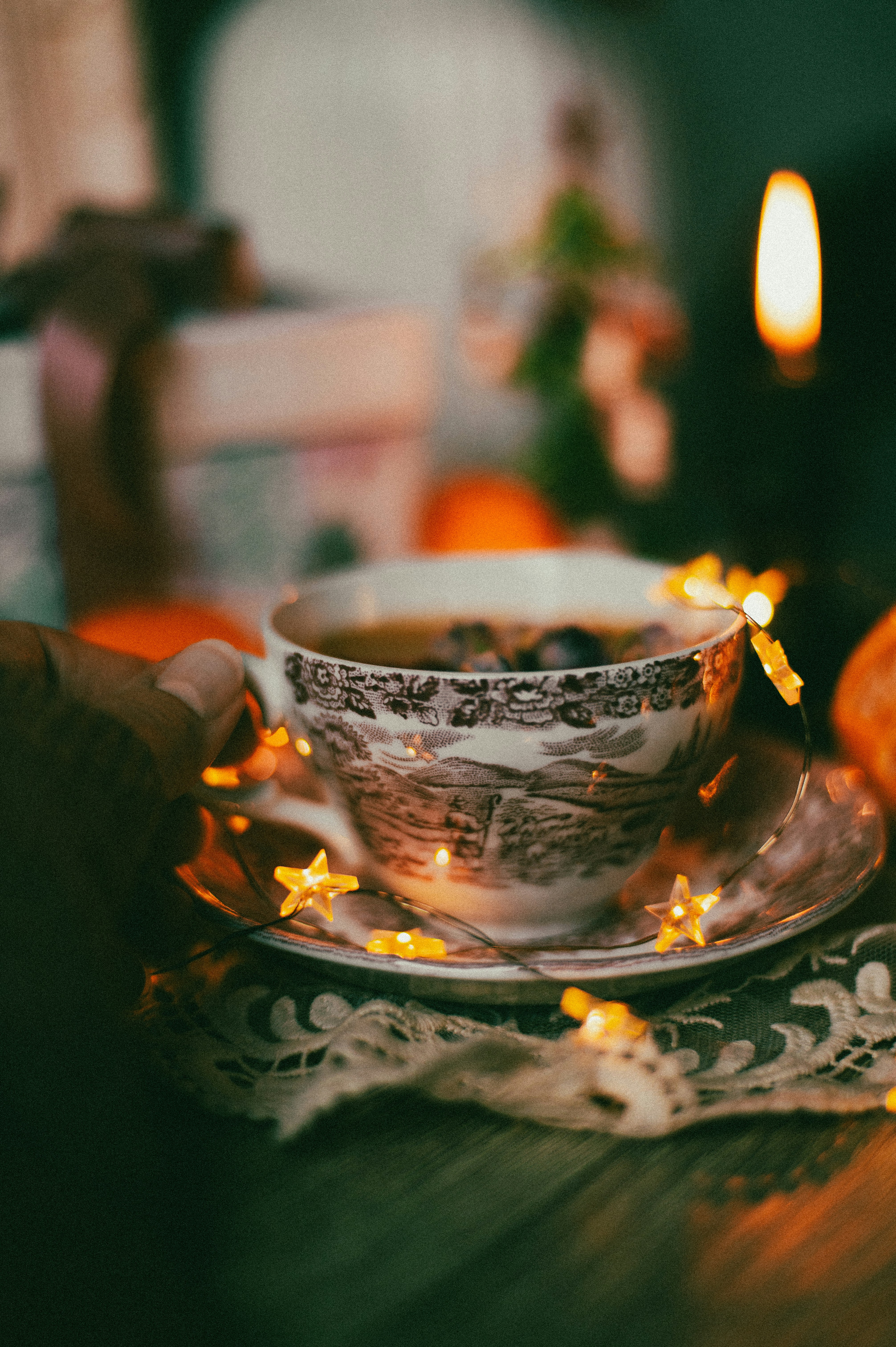 Tea Cup and Warm Lights: A Cozy Moment in Soft Focus