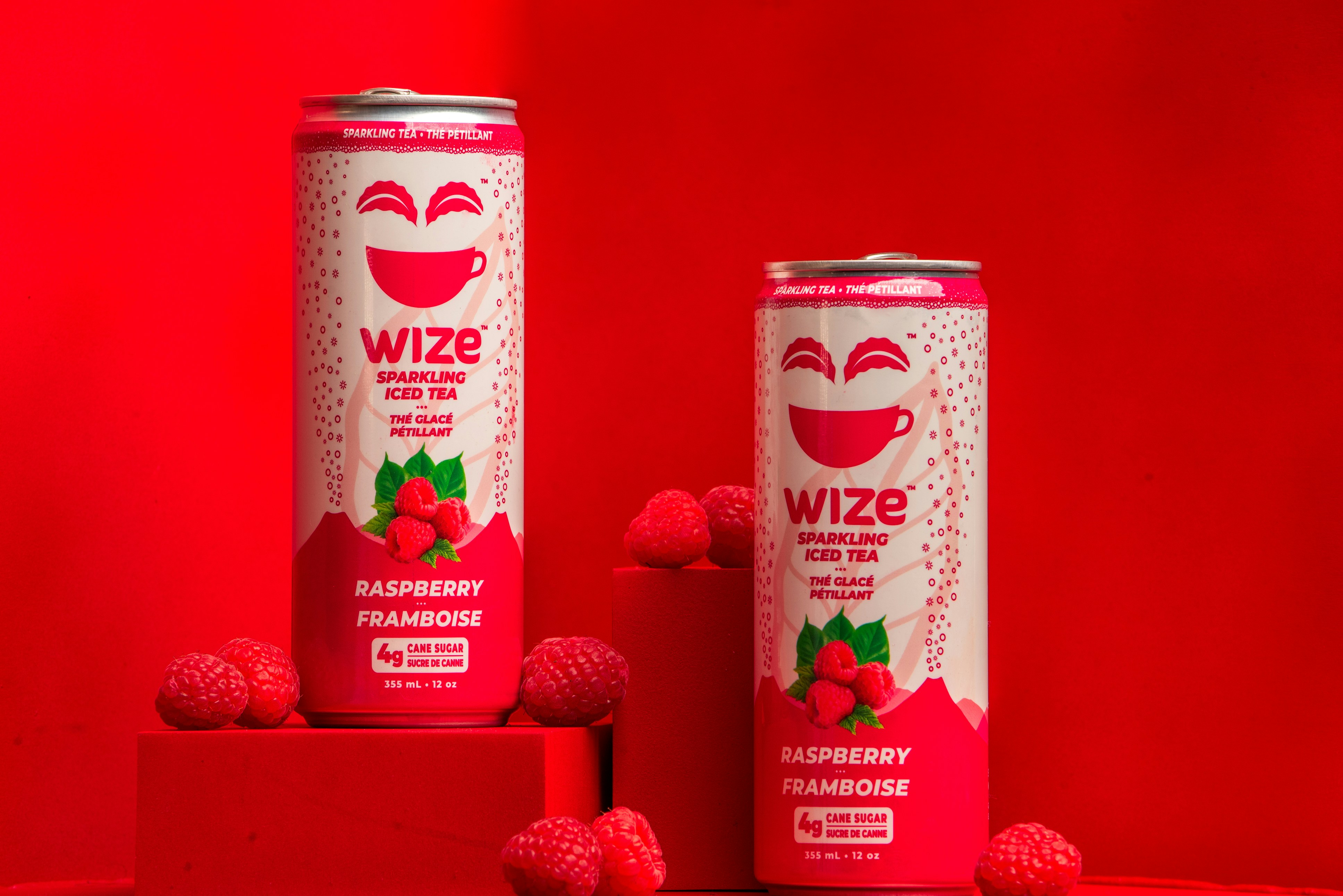 Two cans of wine with raspberries on a red background photo – Free ...