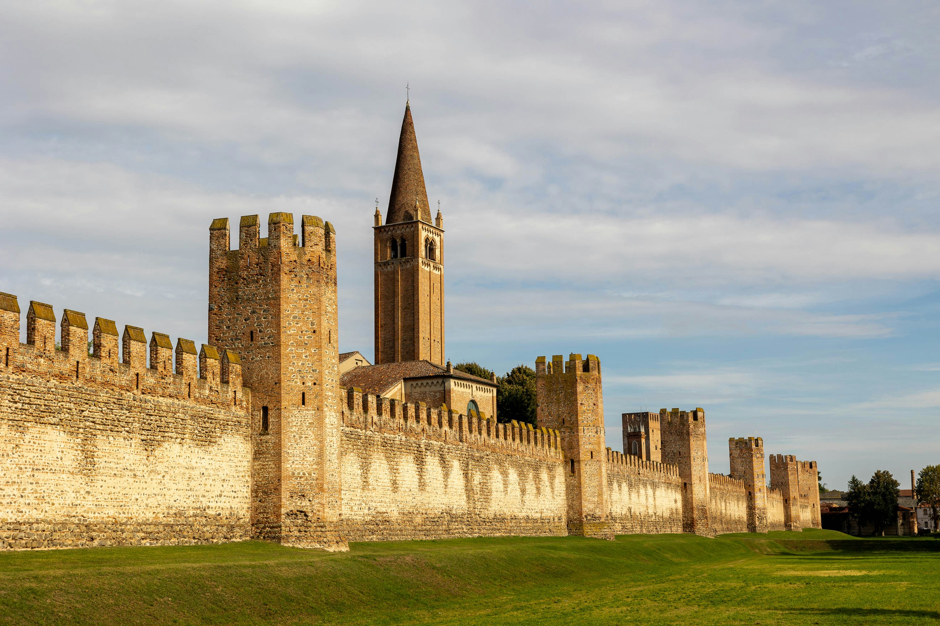 A castle with a tower and a clock on it photo – Free Province of padua ...