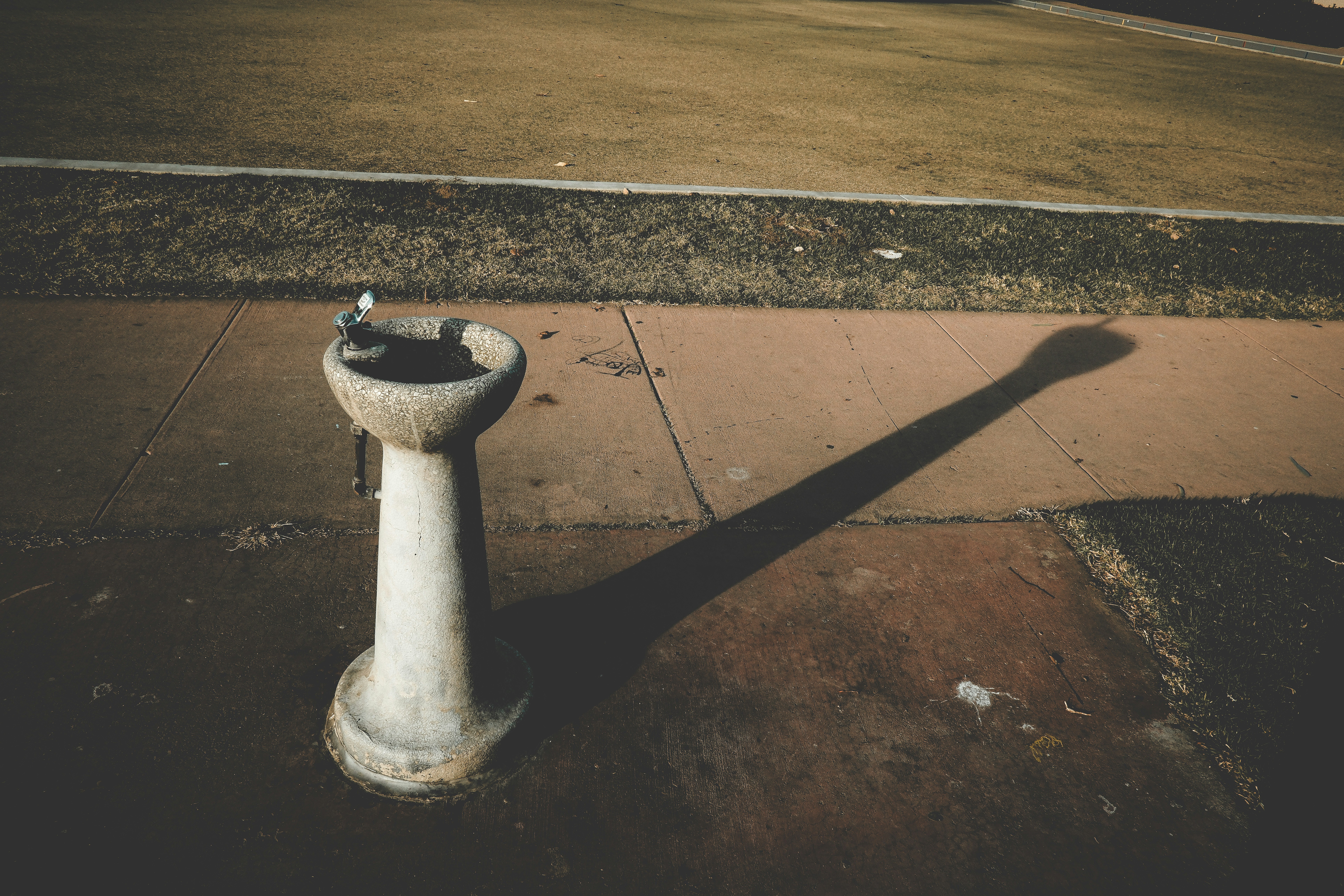 A fire hydrant casting a shadow on a sidewalk photo – Free Park Image ...