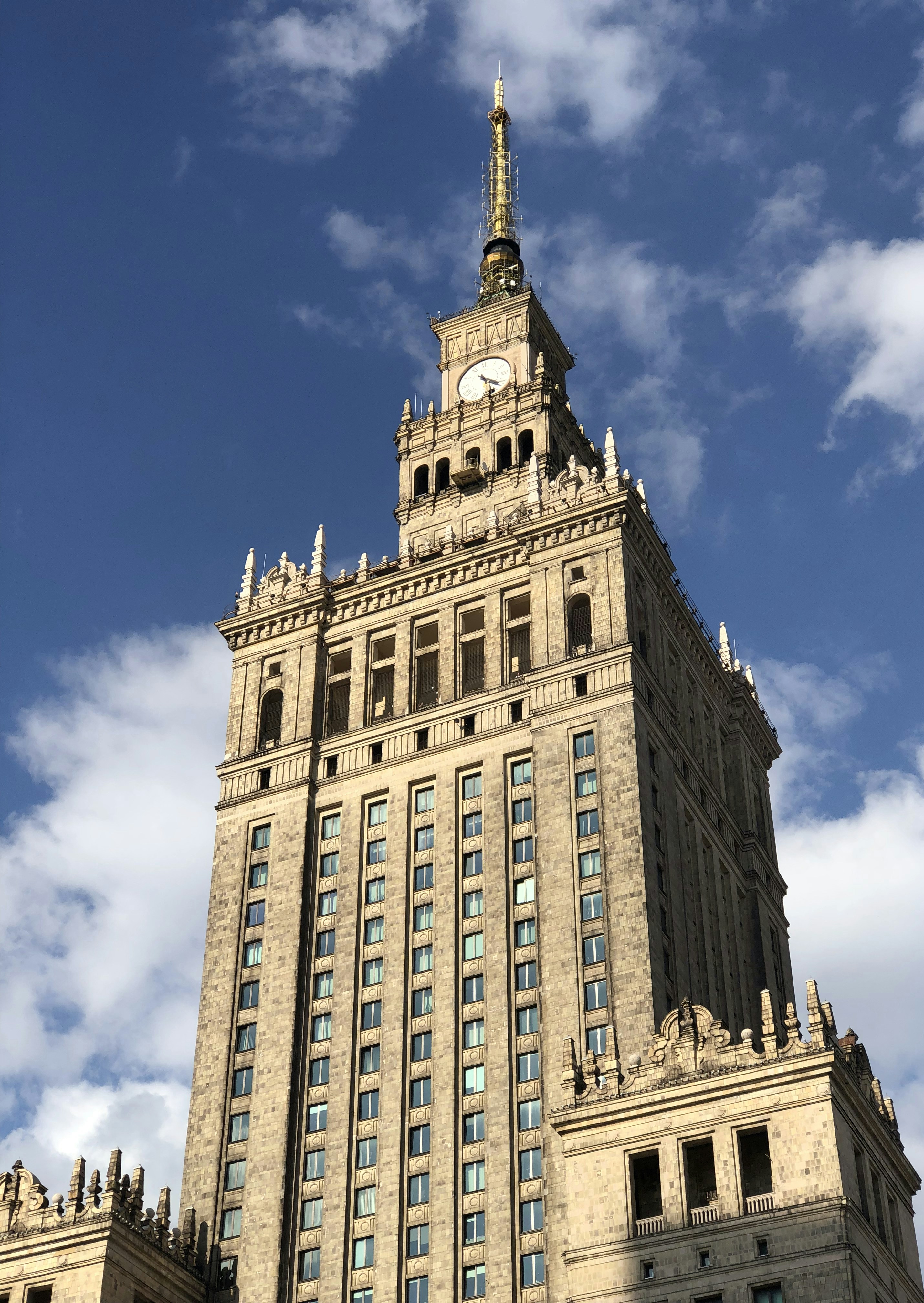 a tall building with a clock on the top of it