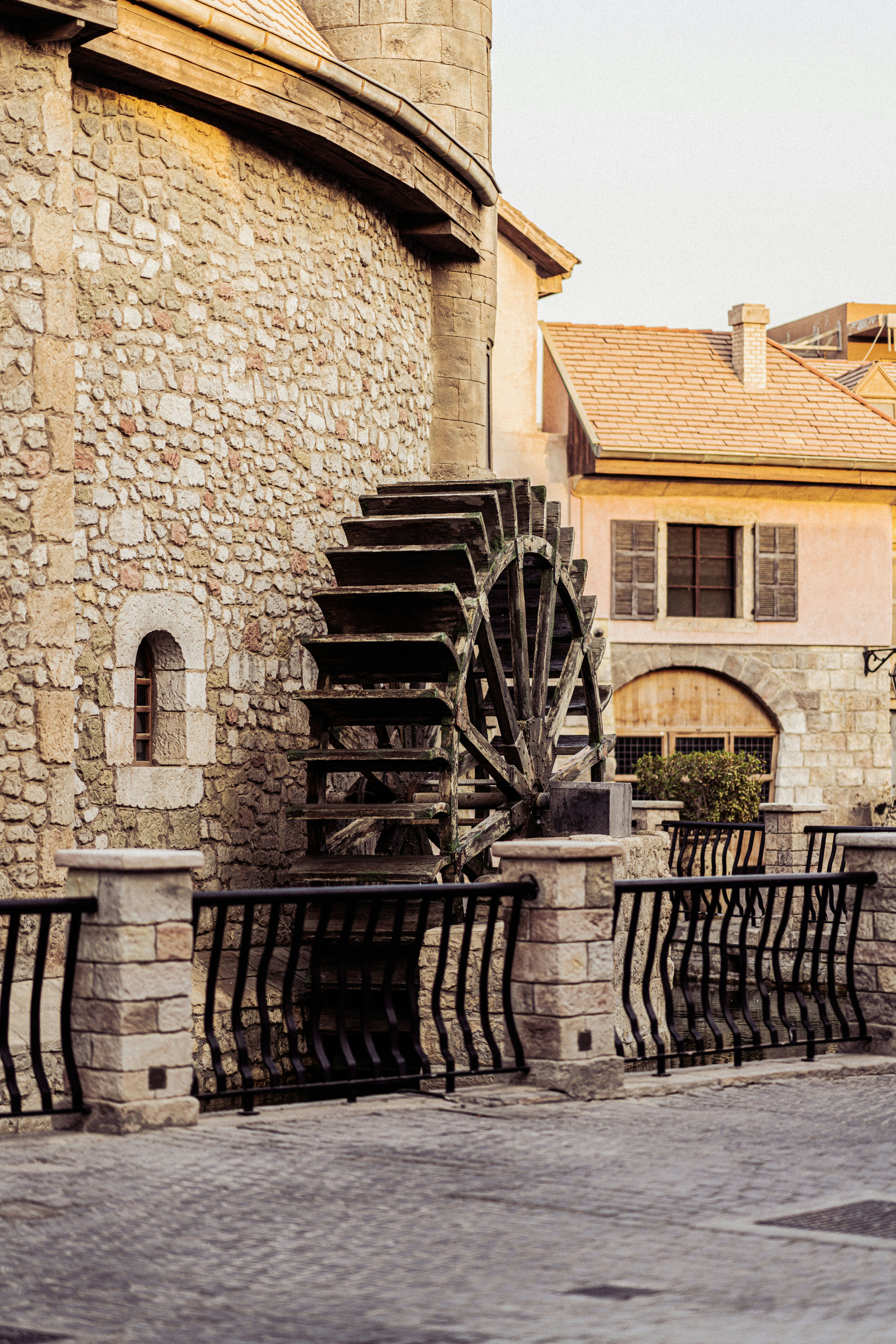 Sunlit Waterwheel in a Timeless Stone Village