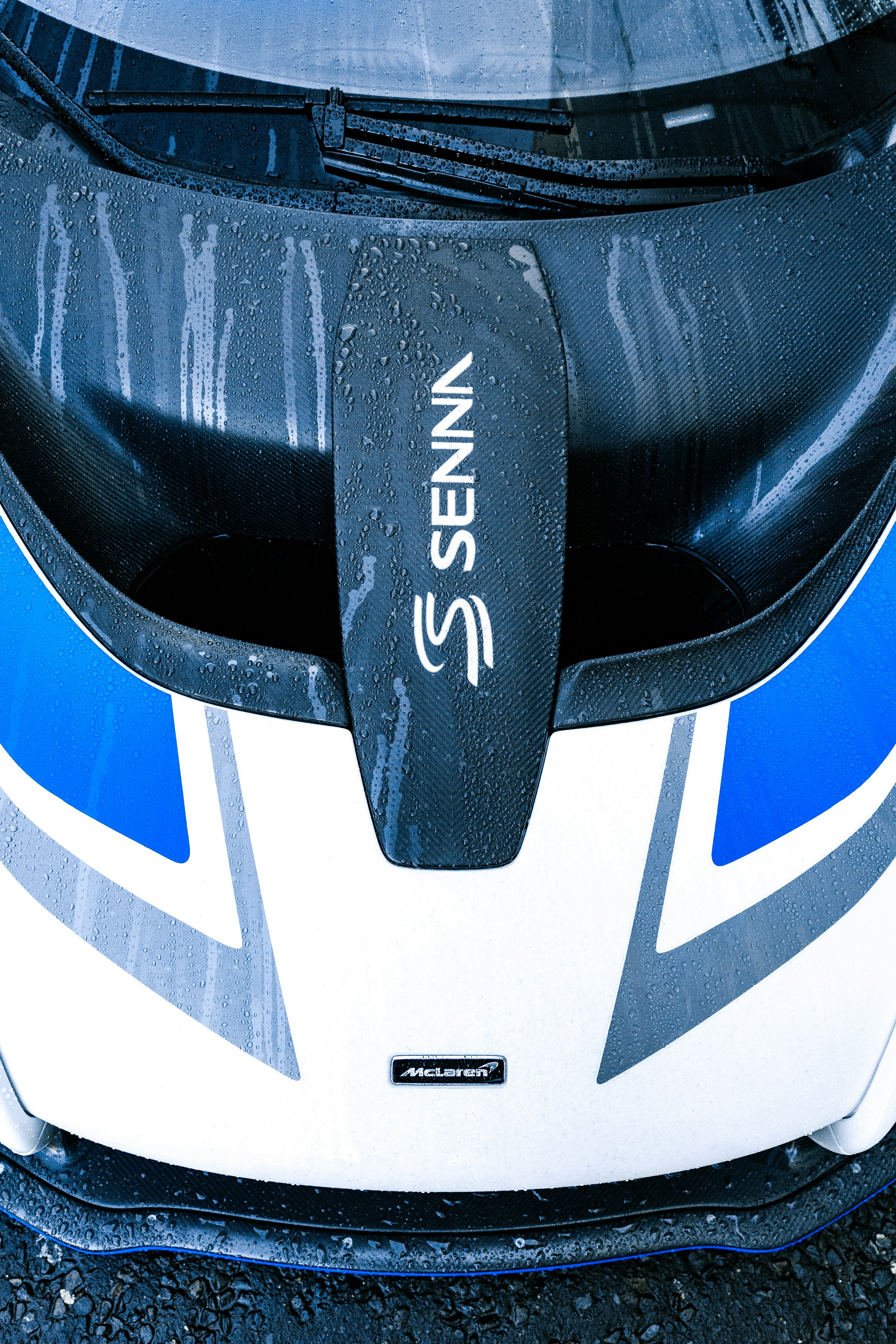 Rain-Slick McLaren Helmet: The Senn Strap Reigns at the Center